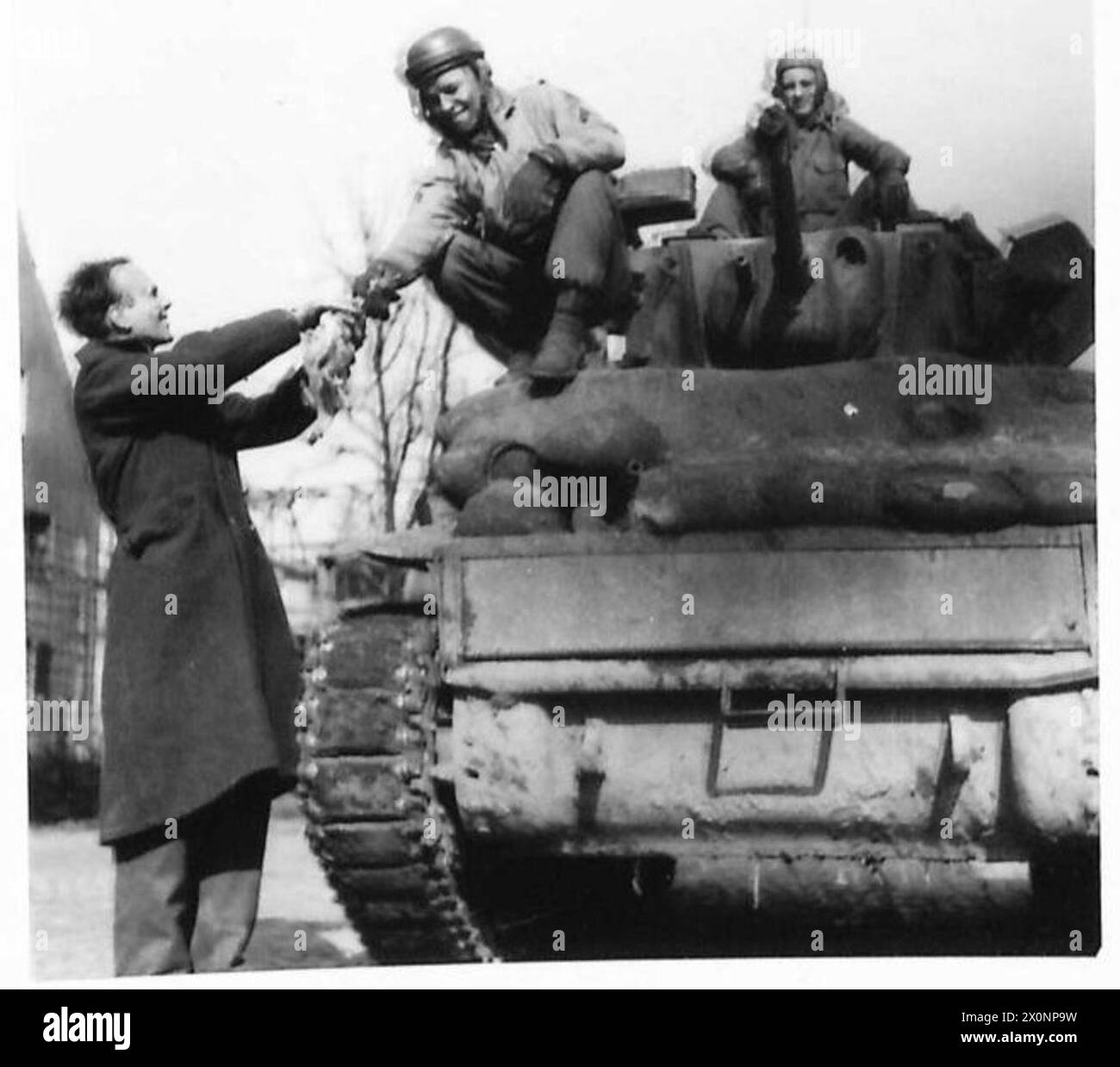 American personnel assist a British prisoner of war at Oflag 79 in ...