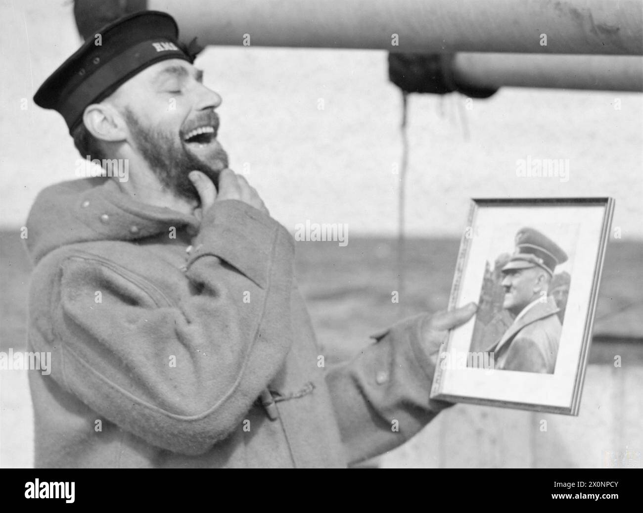 A photograph from April 1942 shows a bearded sailor aboard HMS Ashanti ...