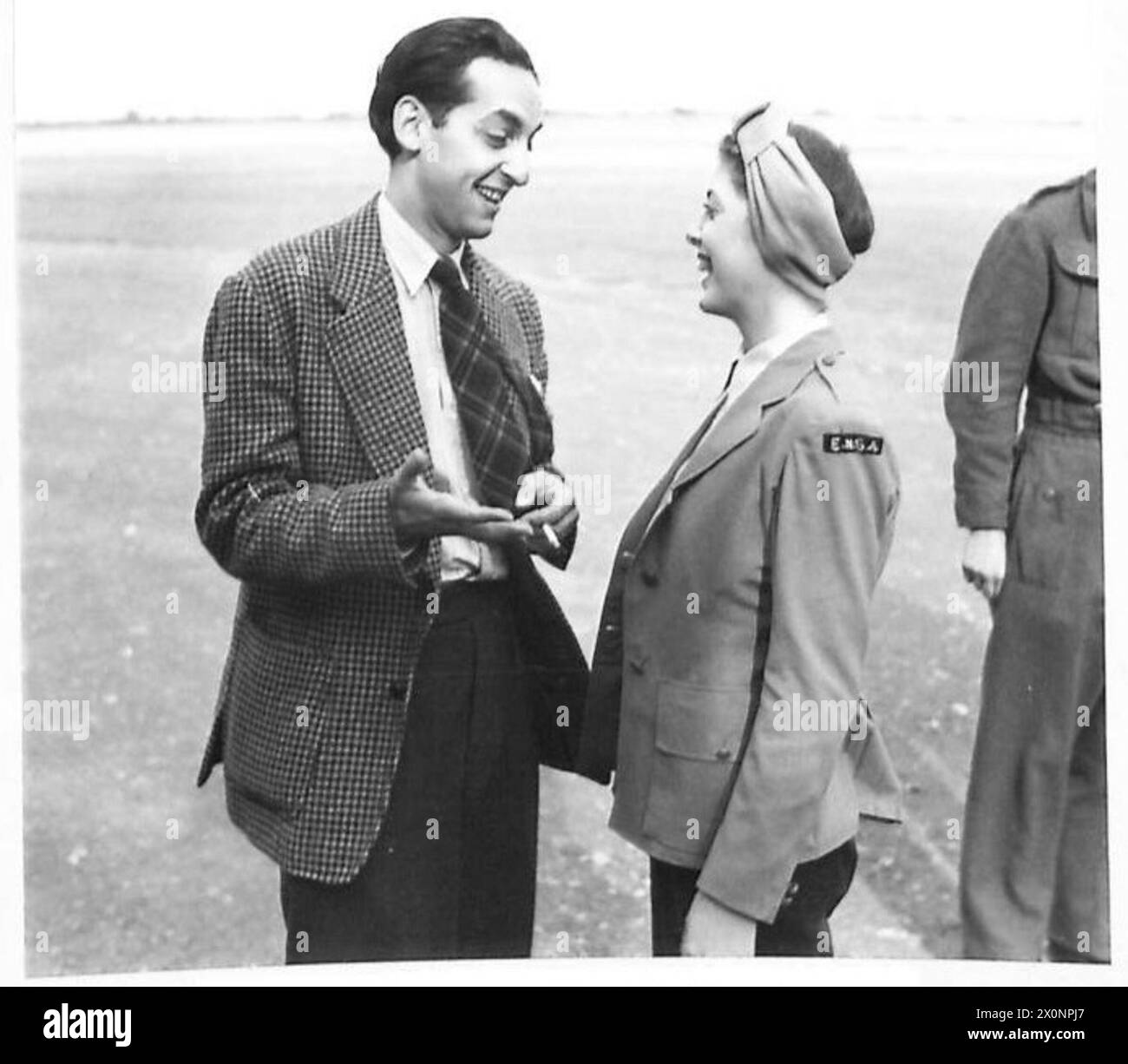 Len Camber and Ruth Howard are pictured on a runway in North Africa ...