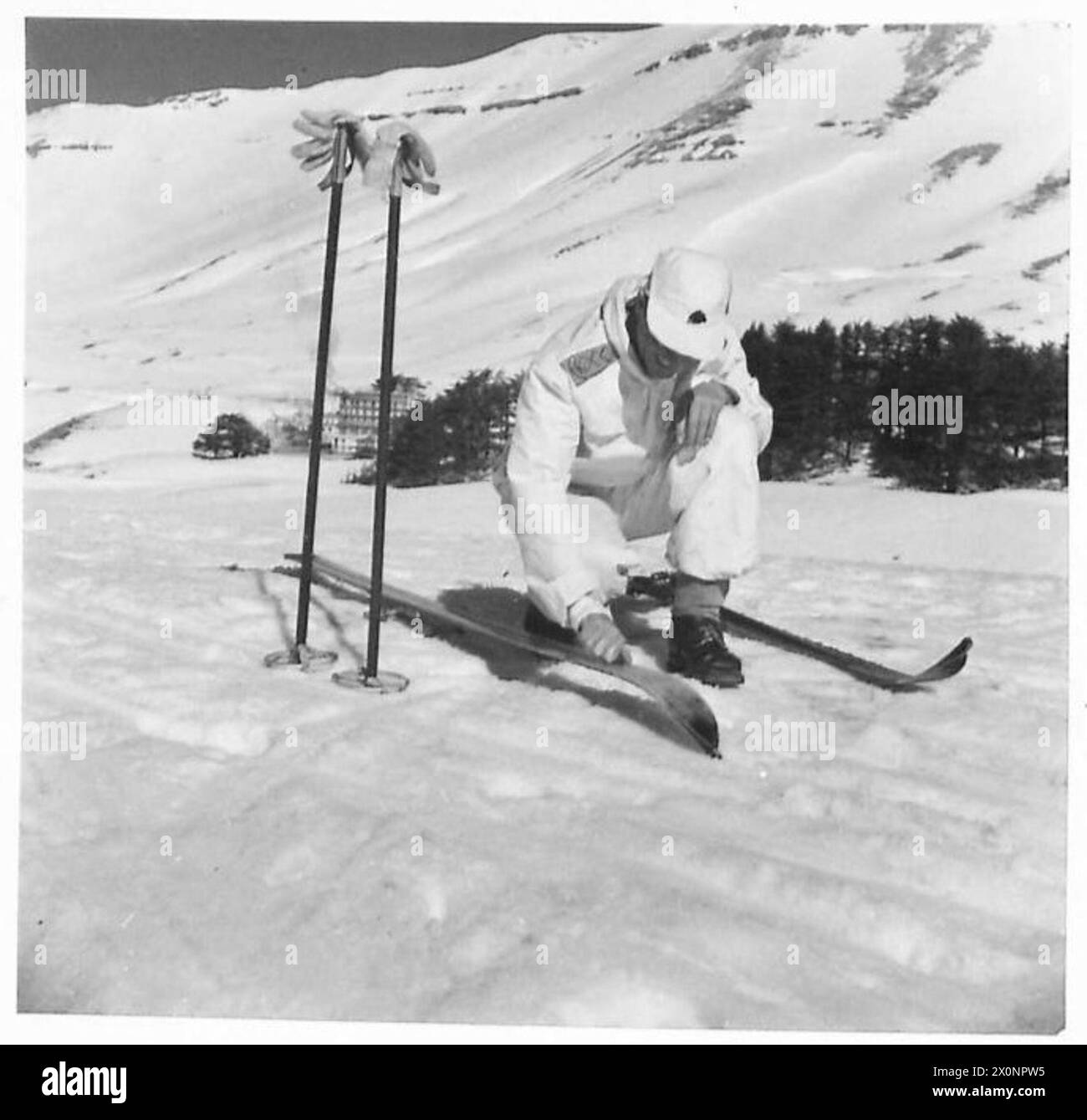 SKI TROOPS IN TRAINING - A ski soldier waxing his skis Photographic ...
