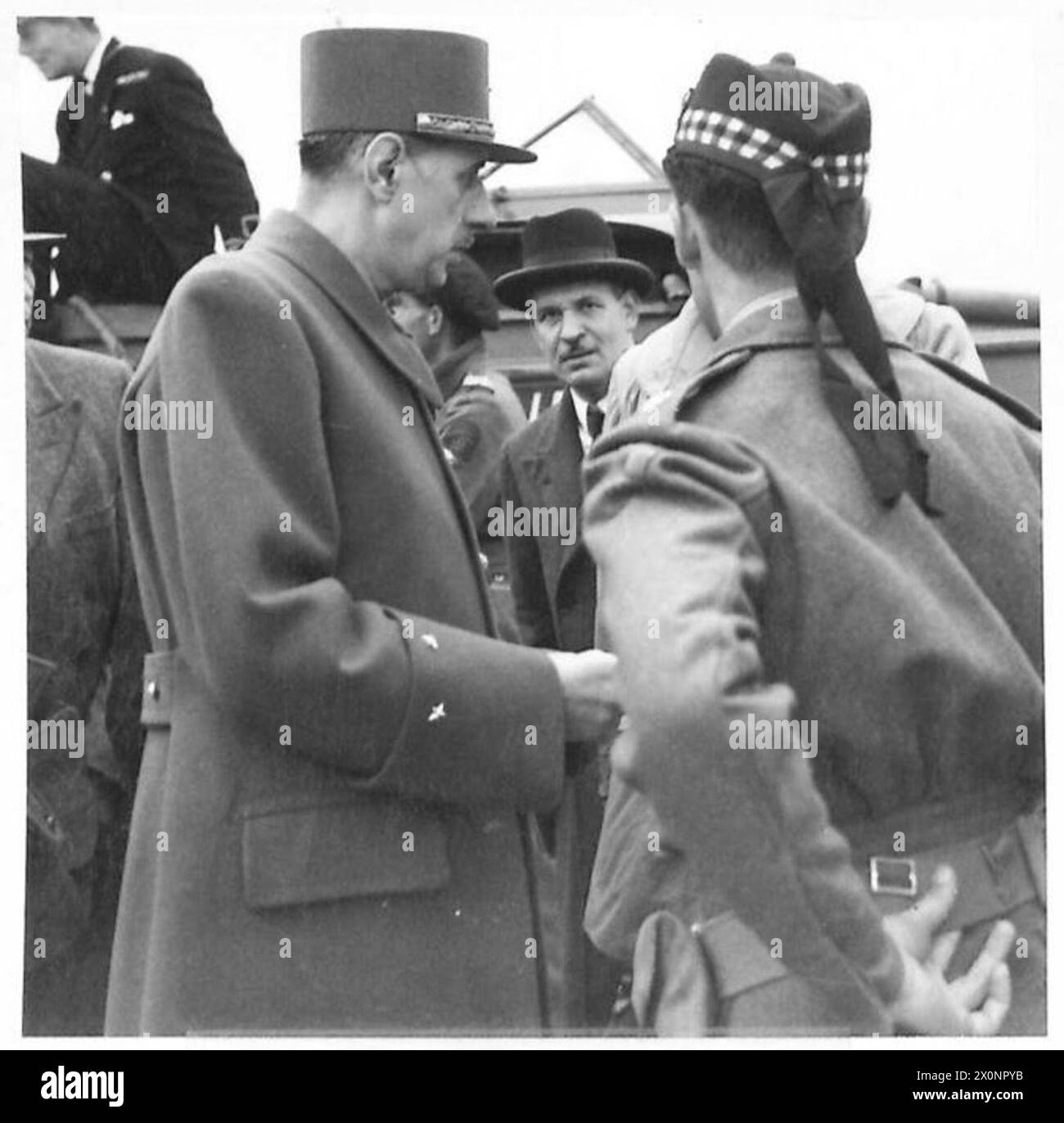 GENERAL DE GAULLE LANDS IN FRANCE - General de Gaulle talking to a member of General Montgomery ...