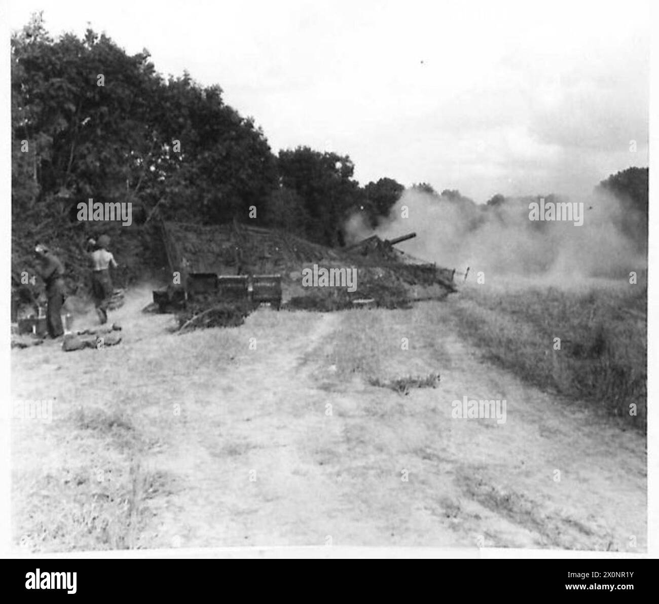 Photograph showing British 4.5-inch artillery guns firing on enemy ...