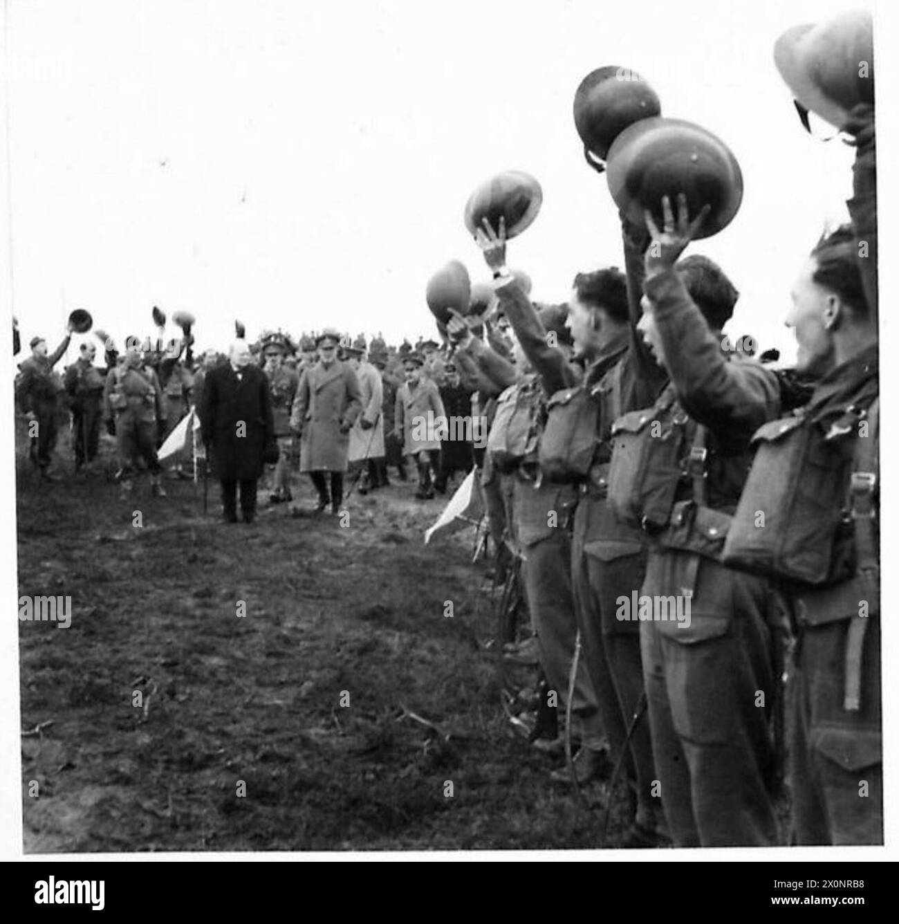Troops cheering the Prime Minister during a tank demonstration ...