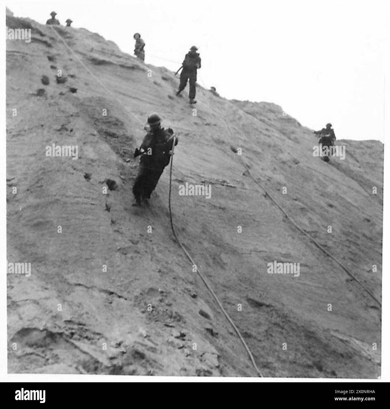 H.M. THE KING SEES ARMY "HARDENING" TACTICS - The men are here seen ...