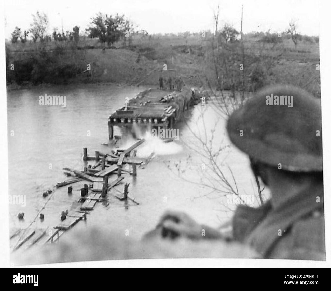 Royal Engineers demolish old German bridge debris and posts to allow a ...