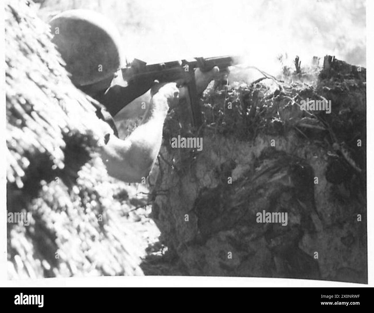 A Fifth Army Ranger Patrol advances up a hillside in Italy under smoke ...
