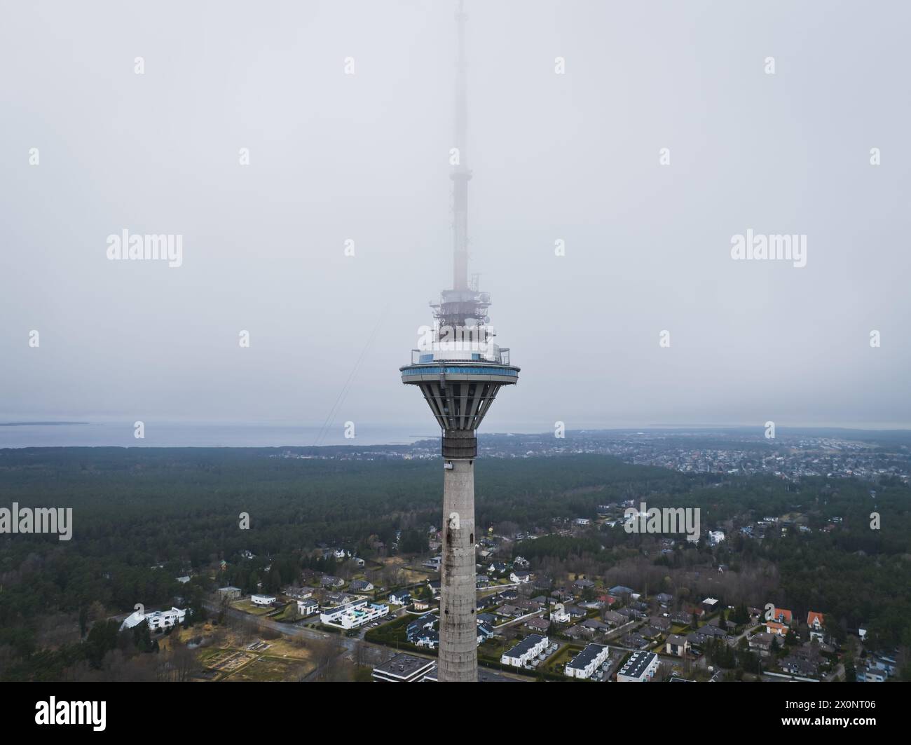 Tallinn TV tower in the fog, photo from above from a drone. Close up ...