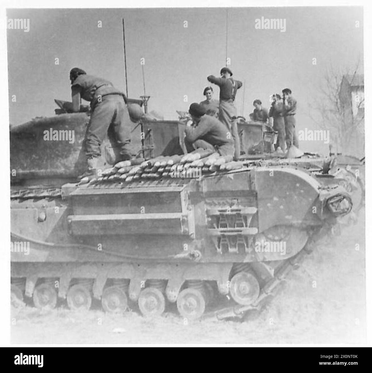 Churchill tanks of the British Army fire on enemy positions during ...