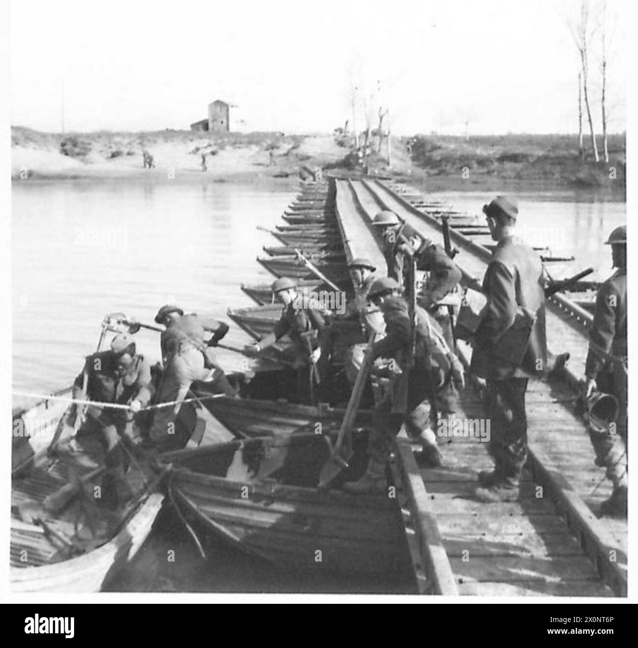 Royal Engineers of the Fifth Army cross the Garigliano River to repair ...