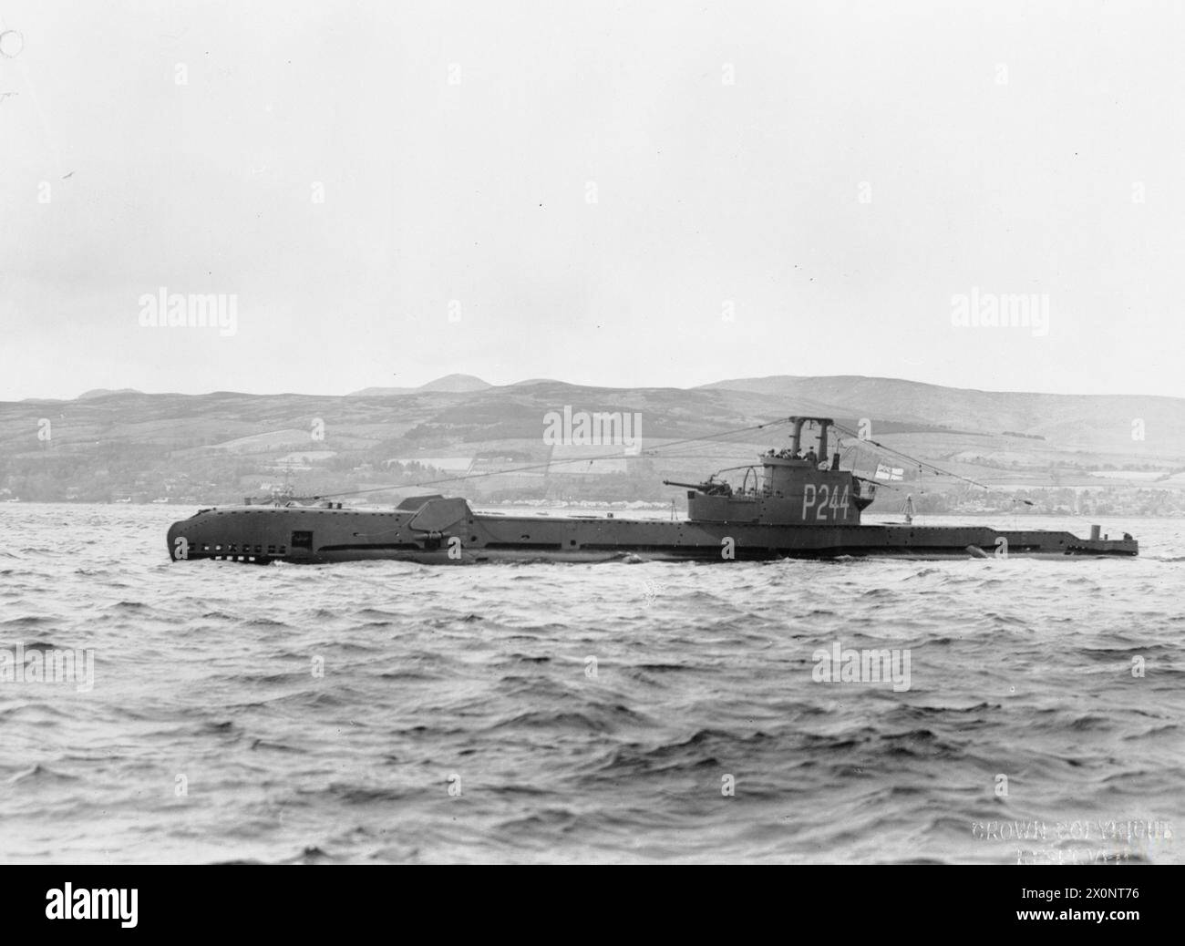 HMS Sea Devil, a Royal Navy submarine of 1945, is underway, showing its ...