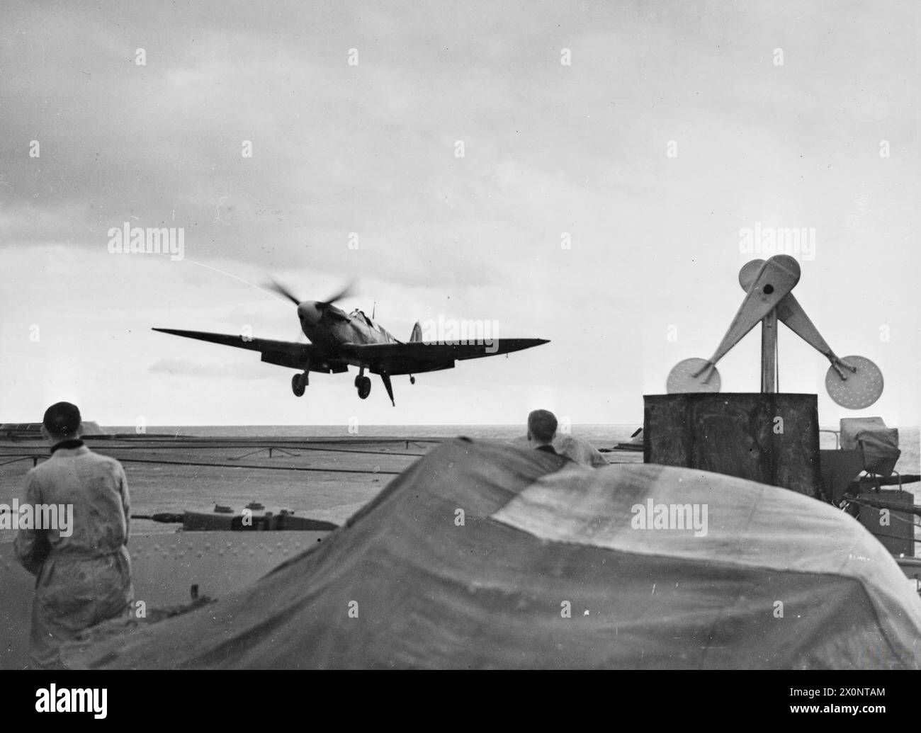 A Seafire fighter aircraft from the Fleet Air Arm prepares to land on ...