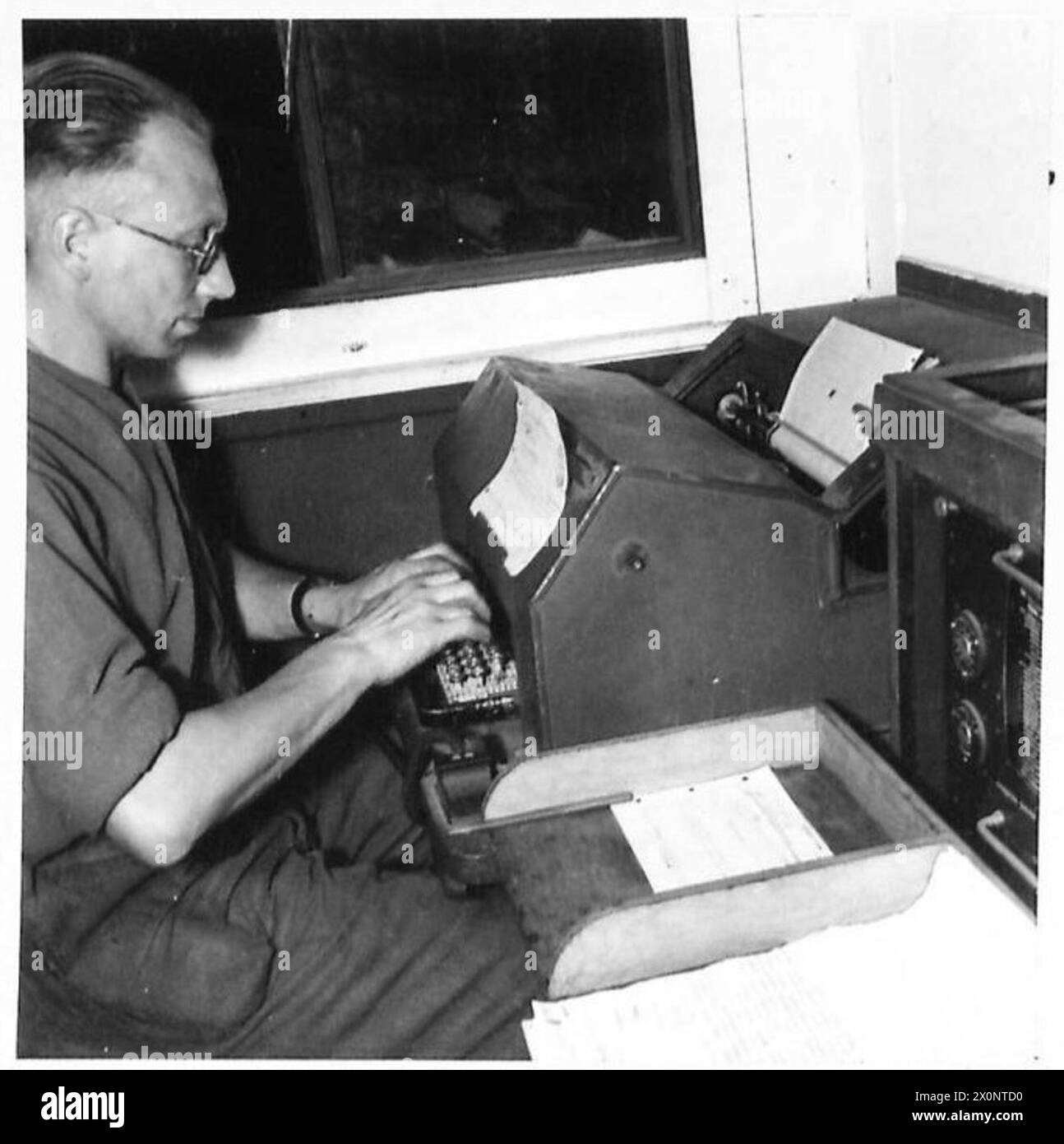 A CORPS HQ. IN FRANCE - One of tie two Teleprinters in operation at Corps Signals Office. One ...