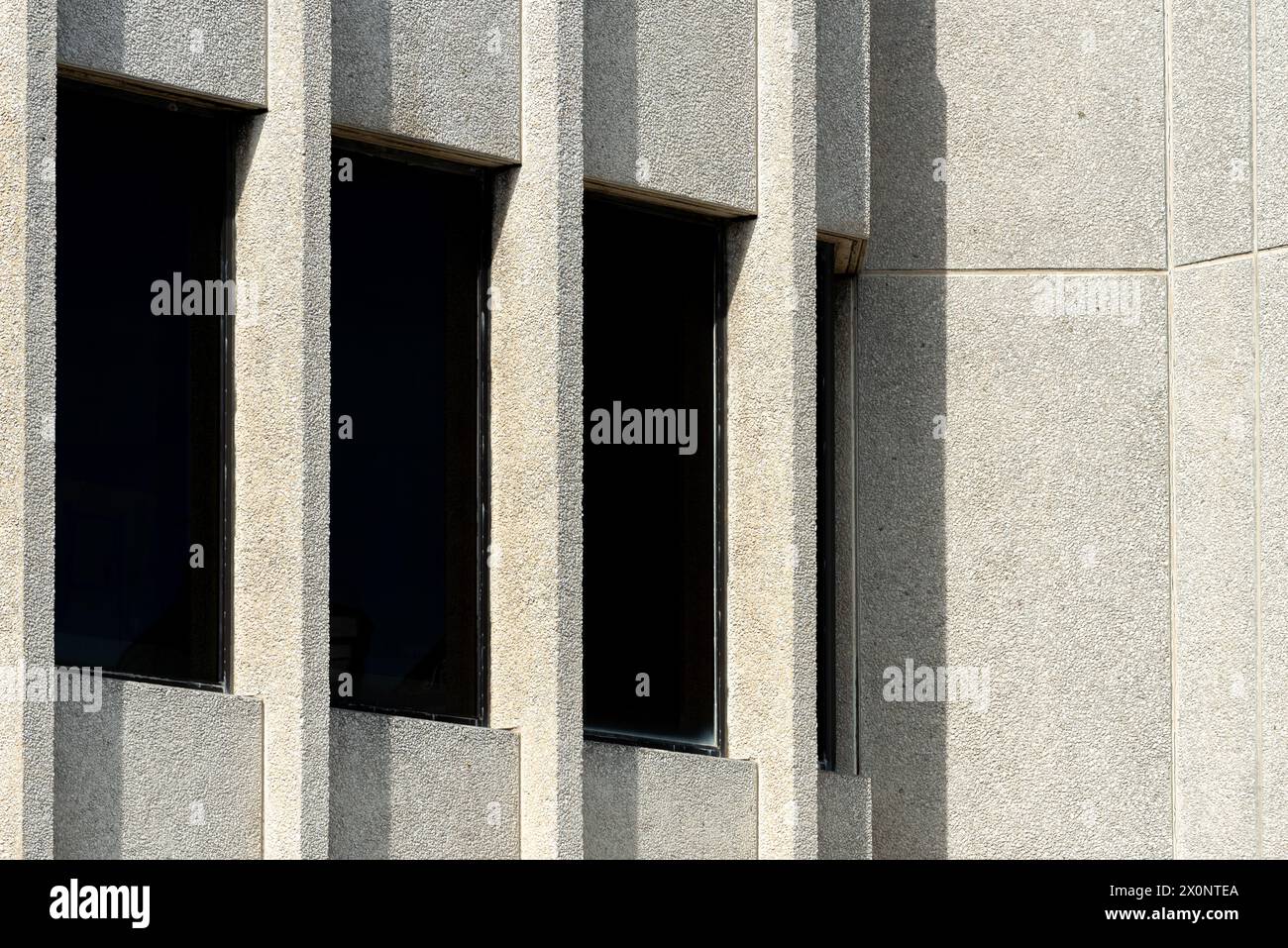 Abstract section of a building with contrasting light and dark areas ...