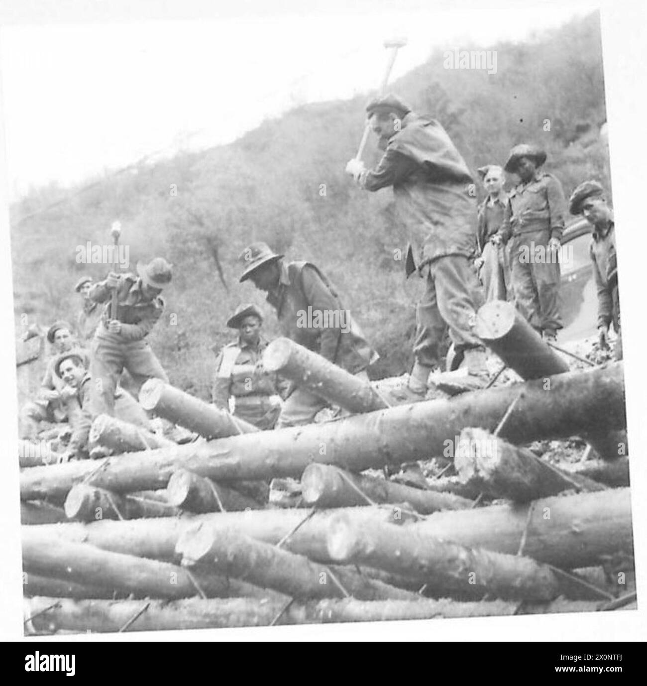 Bechuanas assist in constructing 'cribbings' using criss-crossed logs ...