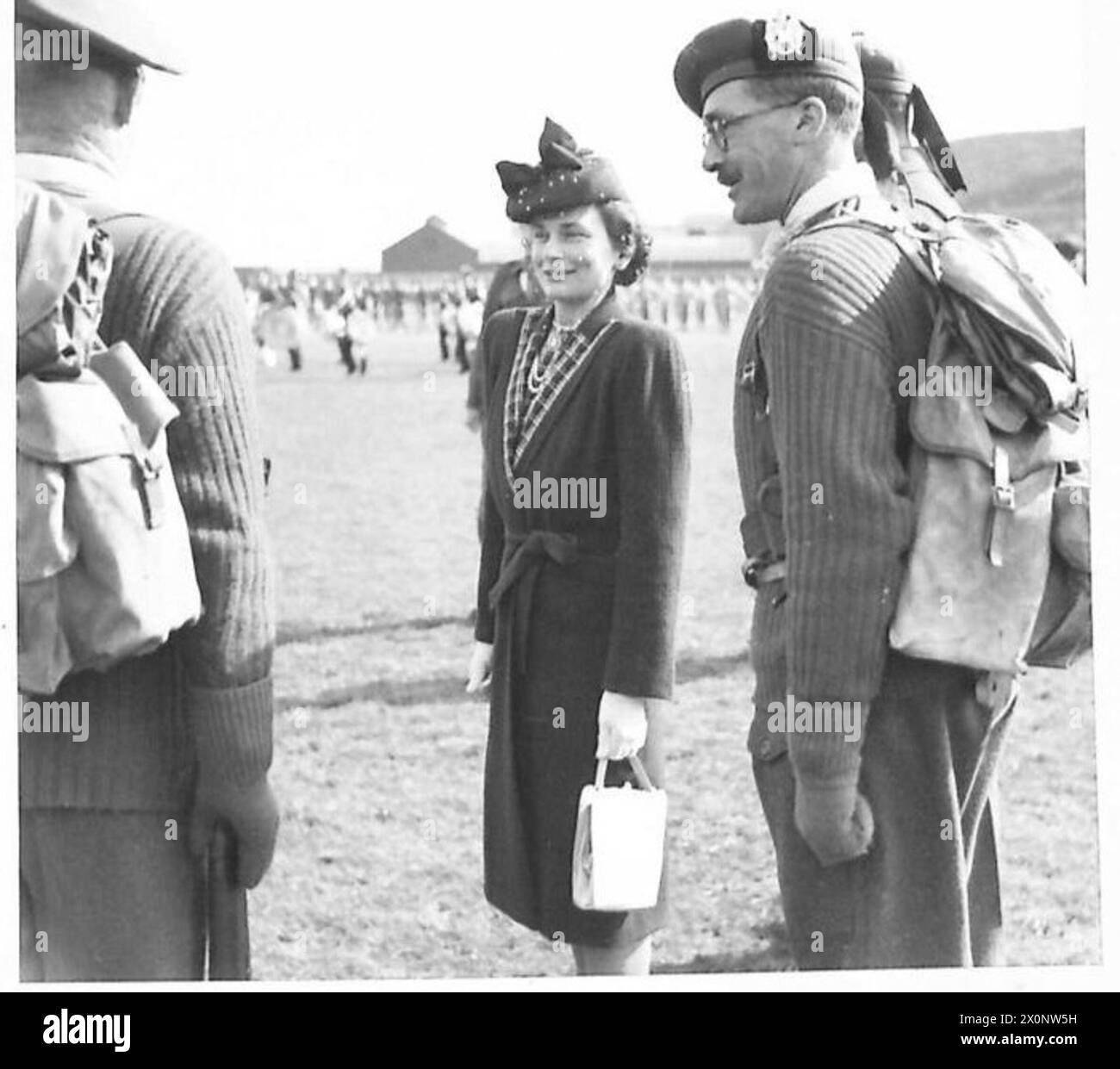 Photograph shows HRH the Duchess of Gloucester inspecting troops ...