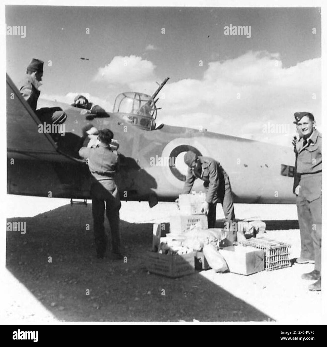Lieut. General Ritchie's food supplies are unloaded from an aircraft ...