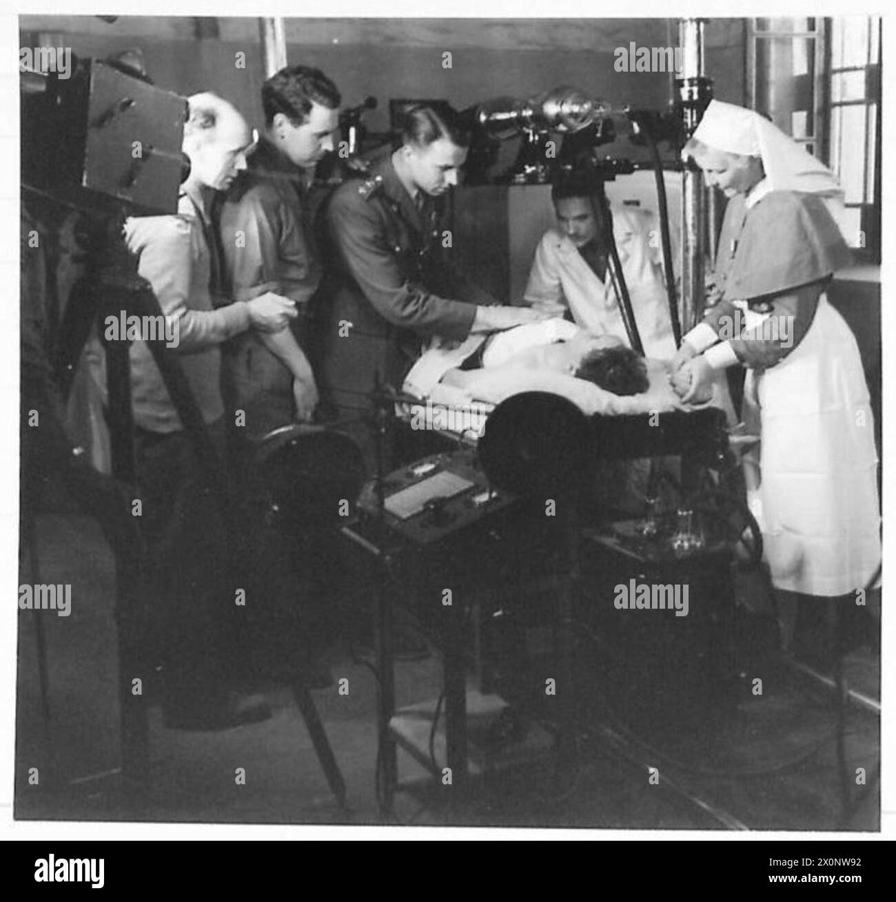 Army Film and Photographic Unit films a military operation inside a ...