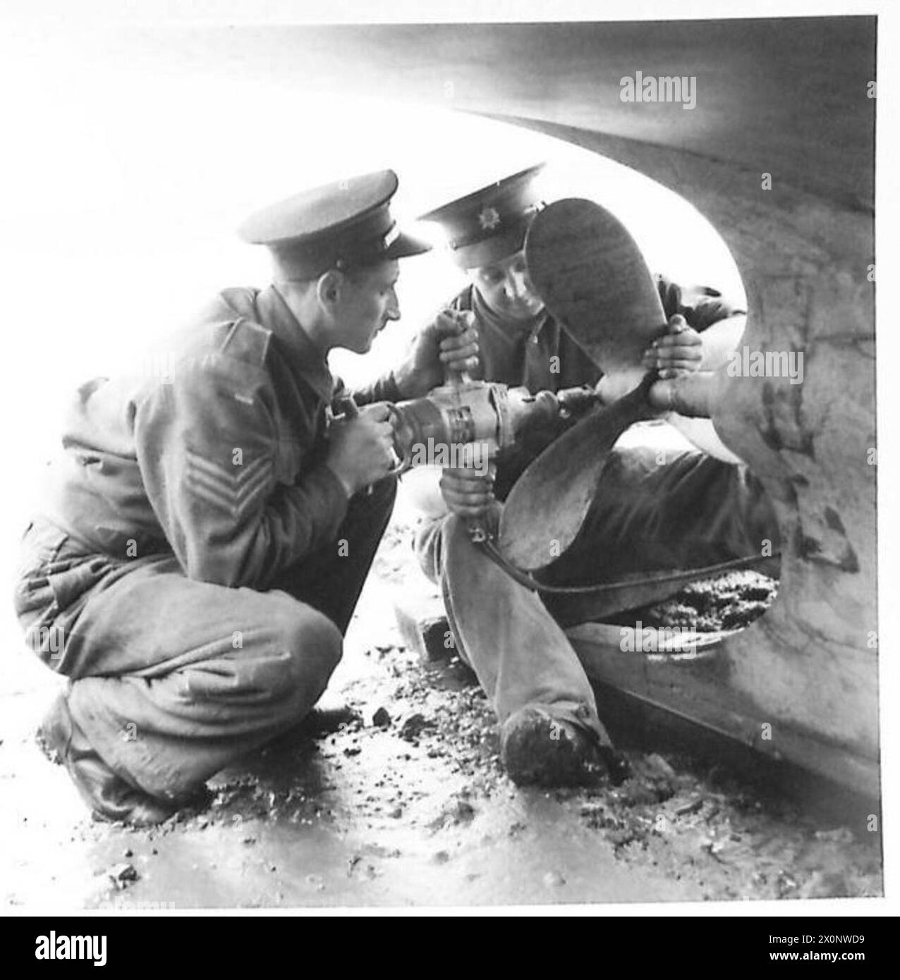 THE ARMY'S NAVY - A sergeant pays special attention to the boat's ...