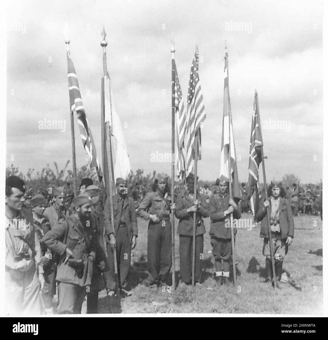 CHETNIKS HAND IN THEIR ARMS - Bearers of the flags of the United ...