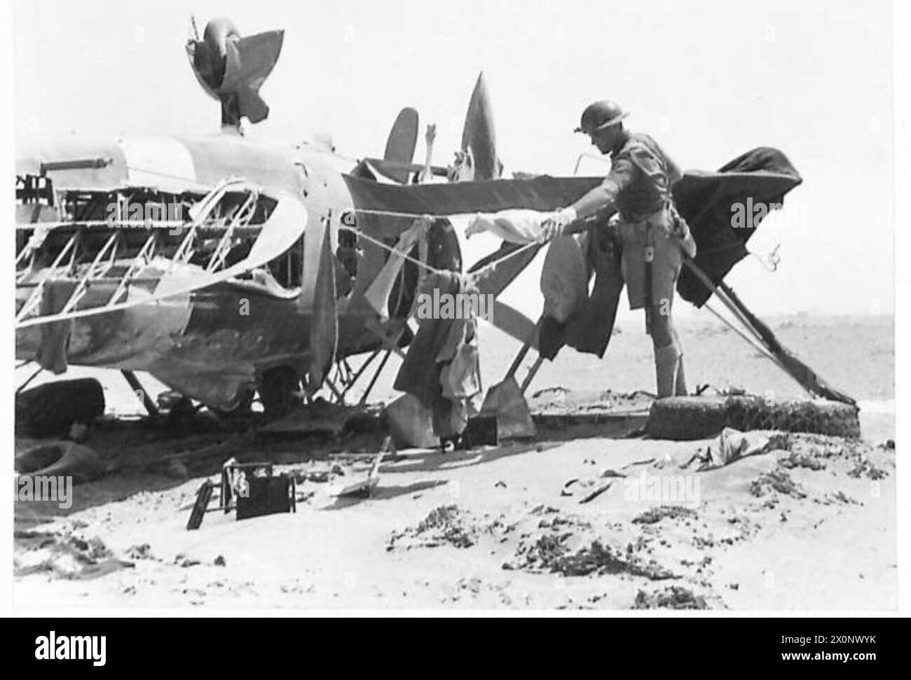 PICTURES FROM TOBRUK - A soldier of the garrison finds the tail of one ...