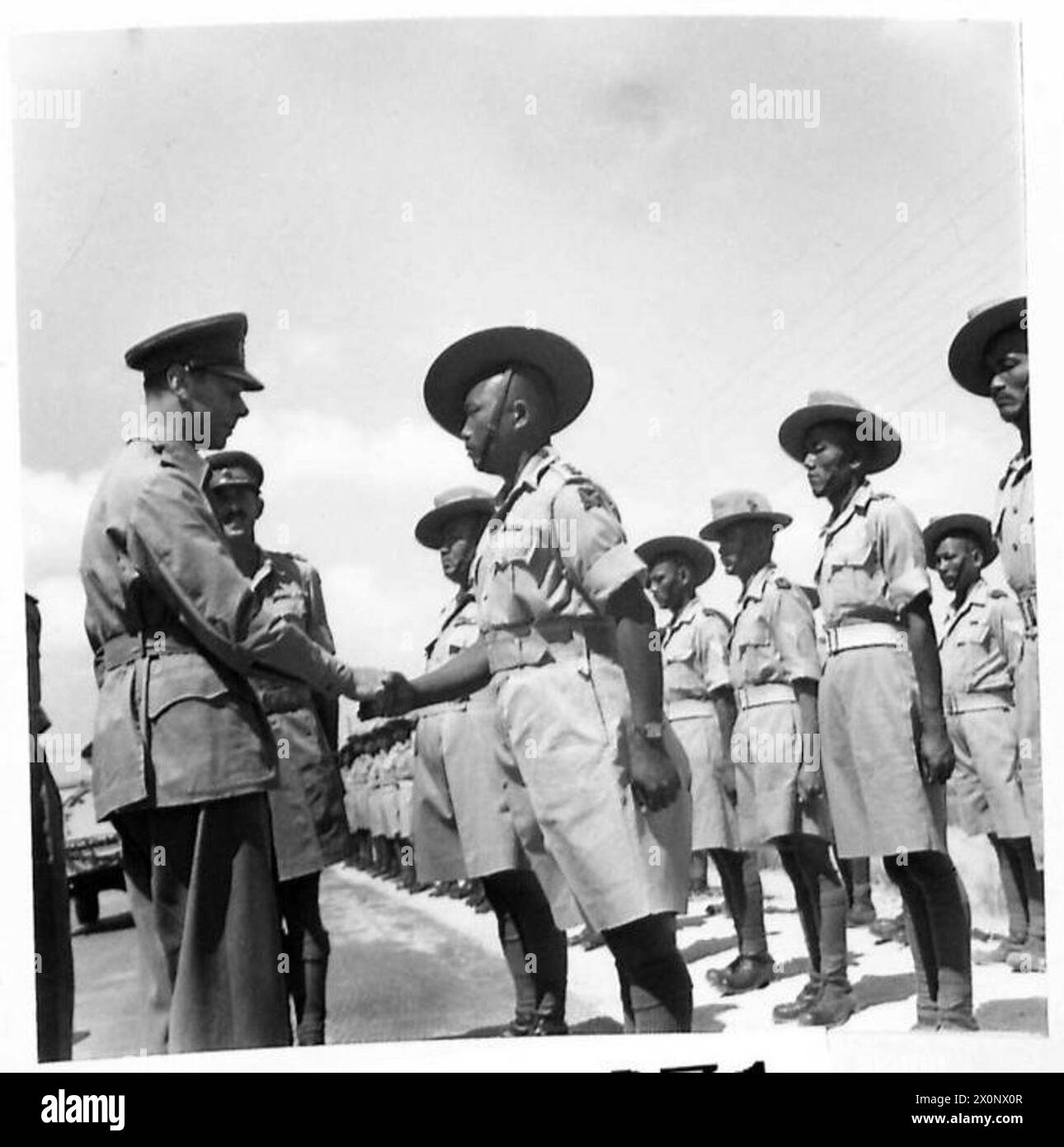 GURKHA WINS V.C. WITH KNIFE - His Majesty shaking hands with Subadar ...