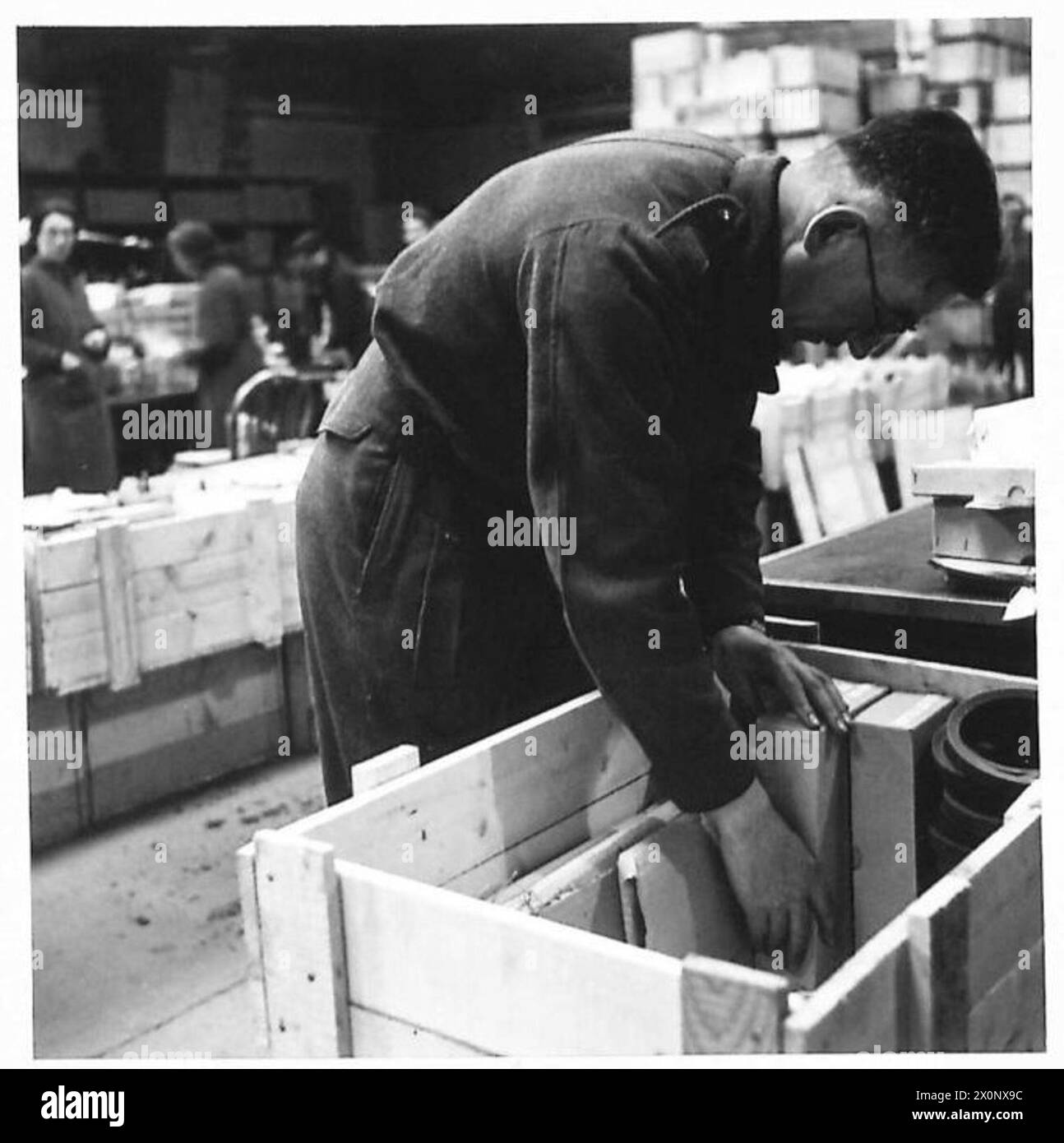 CENTRAL ORDNANCE DEPOT, DERBY - Packing the cartons in a box ...
