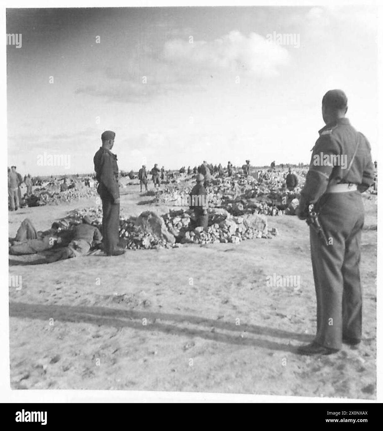 German prisoners of war dig trenches under guard of Military Police ...