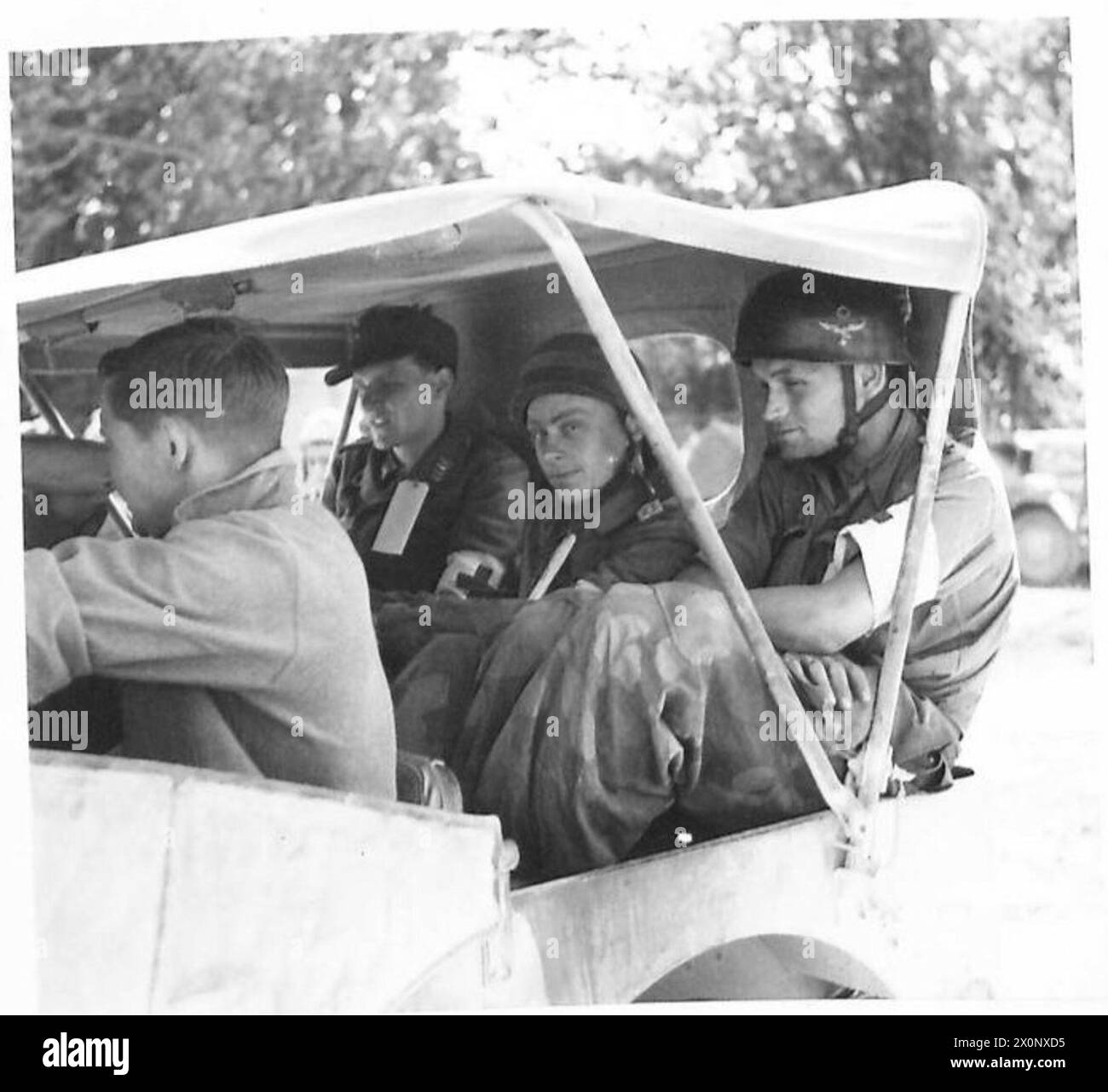 Photograph showing three German medical orderlies being transported to ...