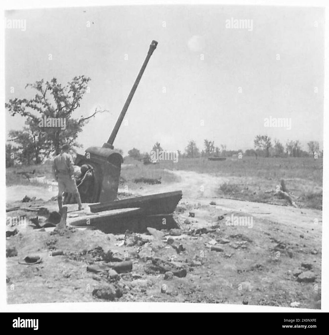 A 75 mm gun on the Hitler Line points skyward after a direct hit ...