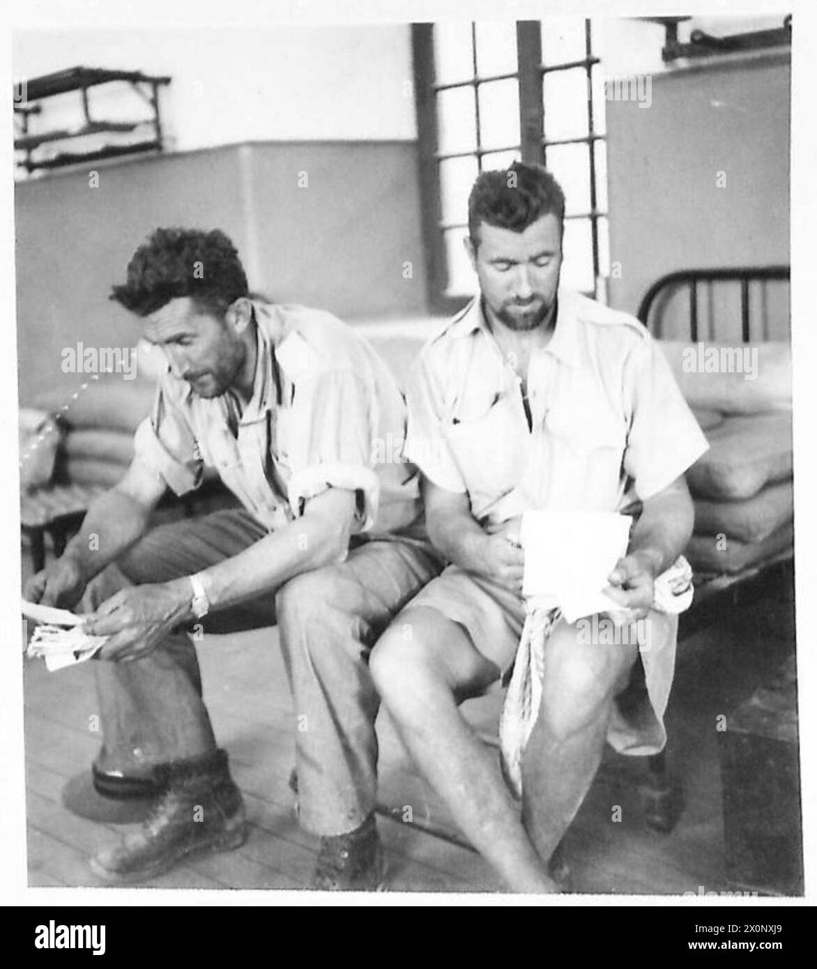British Army personnel in North Africa and the Middle East read letters ...