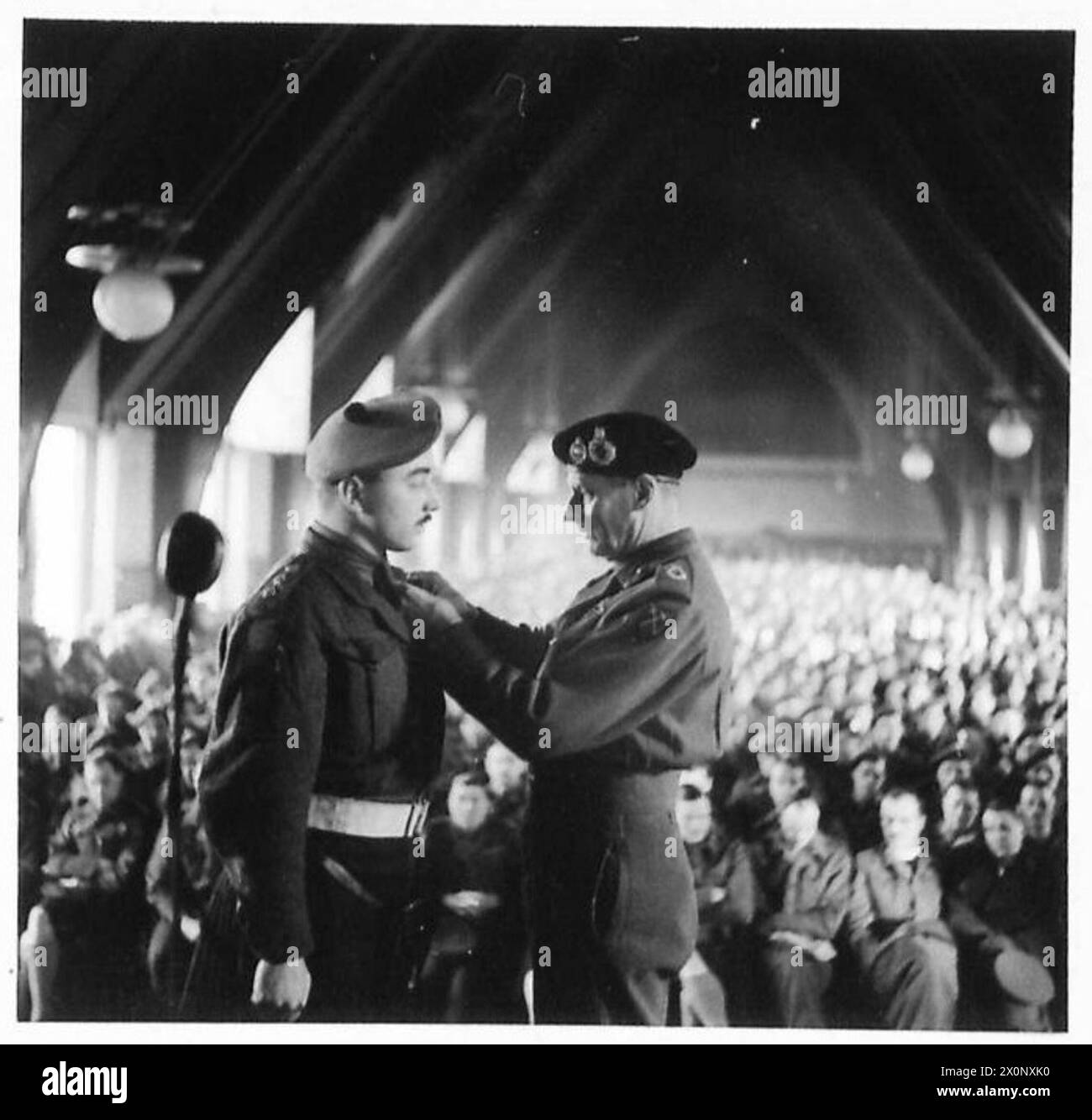 Captain A.M. Simpson of the 7th Battalion, 51st Highland Division, is ...