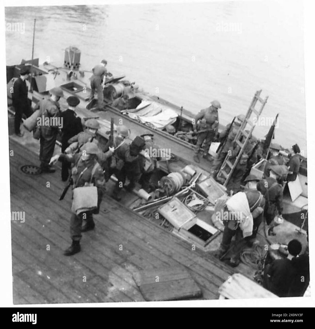 Canadian troops embark in landing craft for a combined operations ...