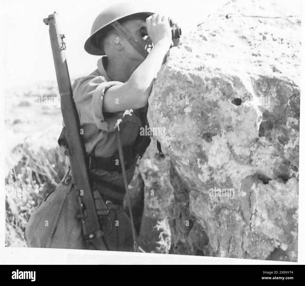 A British Army sentry observing the Syrian border. The soldier is ...