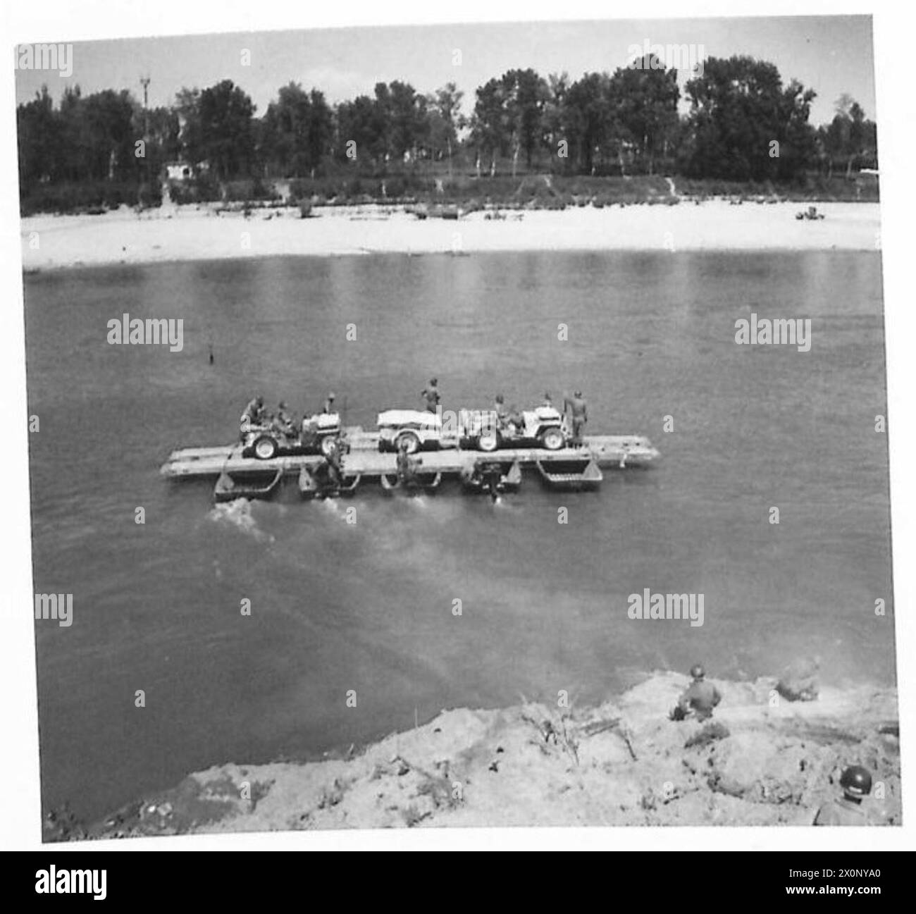 Vehicles are ferried across the River Po on a power-driven raft by the ...