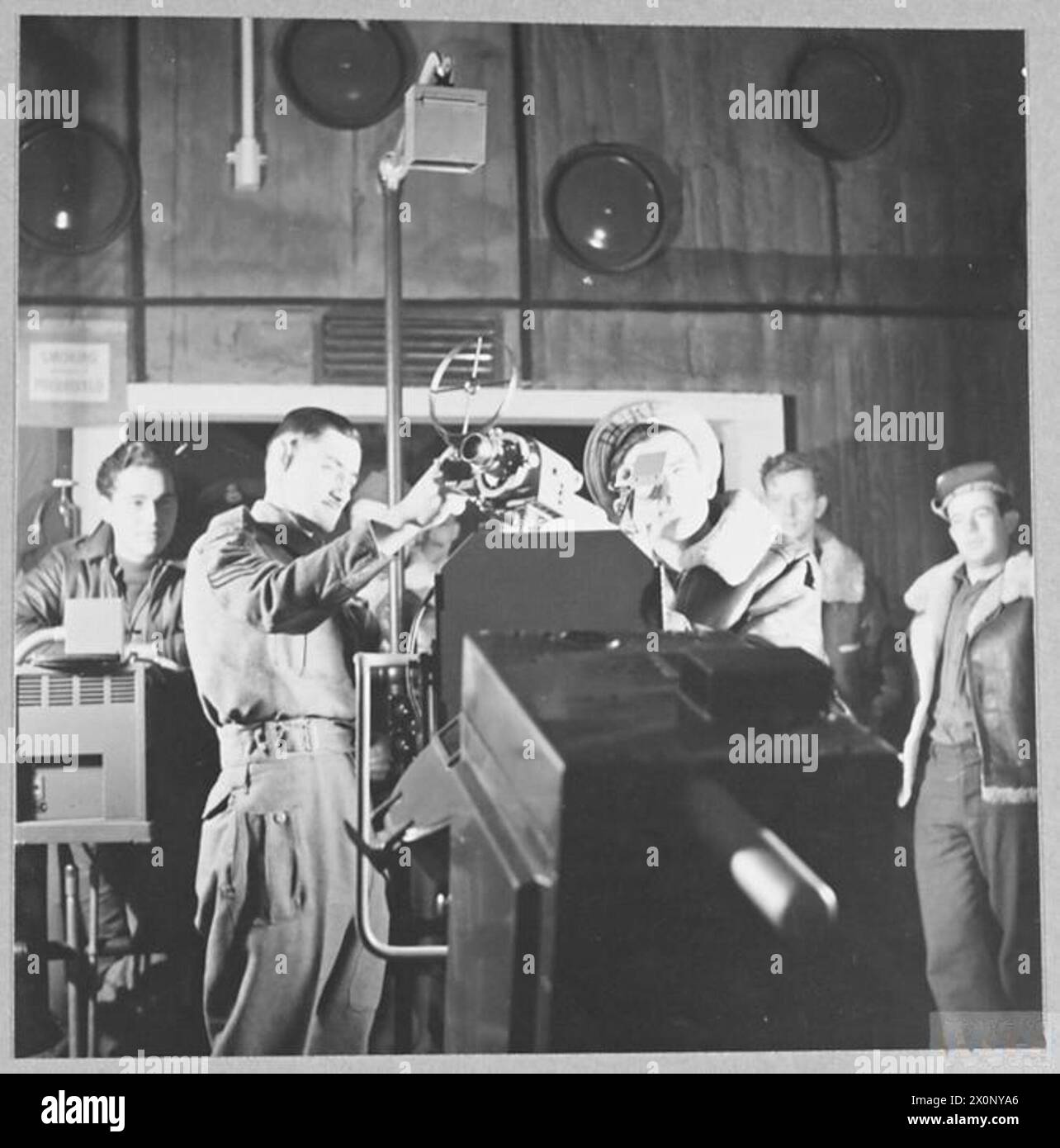 A Royal Air Force Regiment corporal instructs U.S. aircrews in gunnery ...
