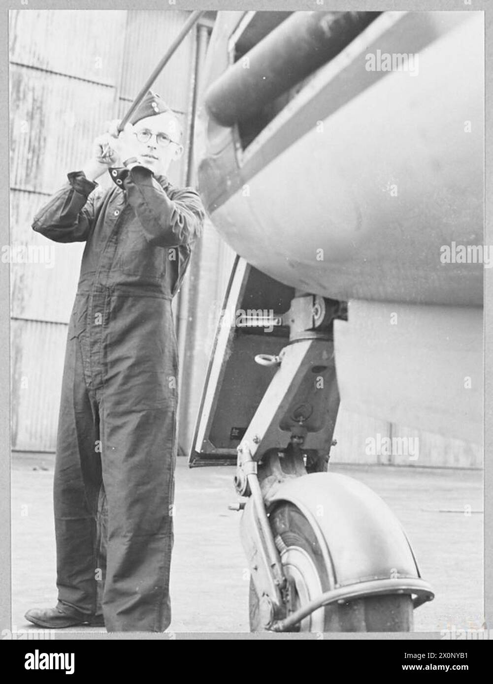 WORK AT AN R.A.F. STATION - Picture issued 1945 shows - An R.A.F ...