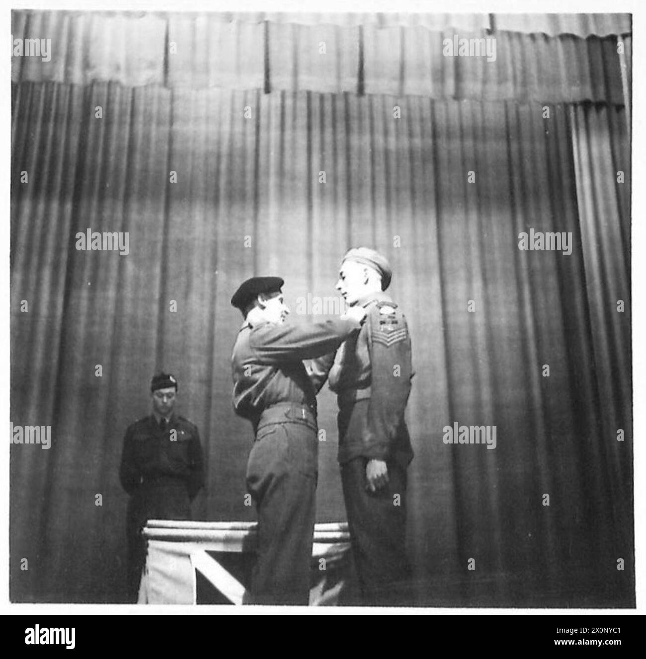 INVESTITURE 12 Corps Troops - Sjt J.A. Henle 86 A/Tk Regt RA receives ...