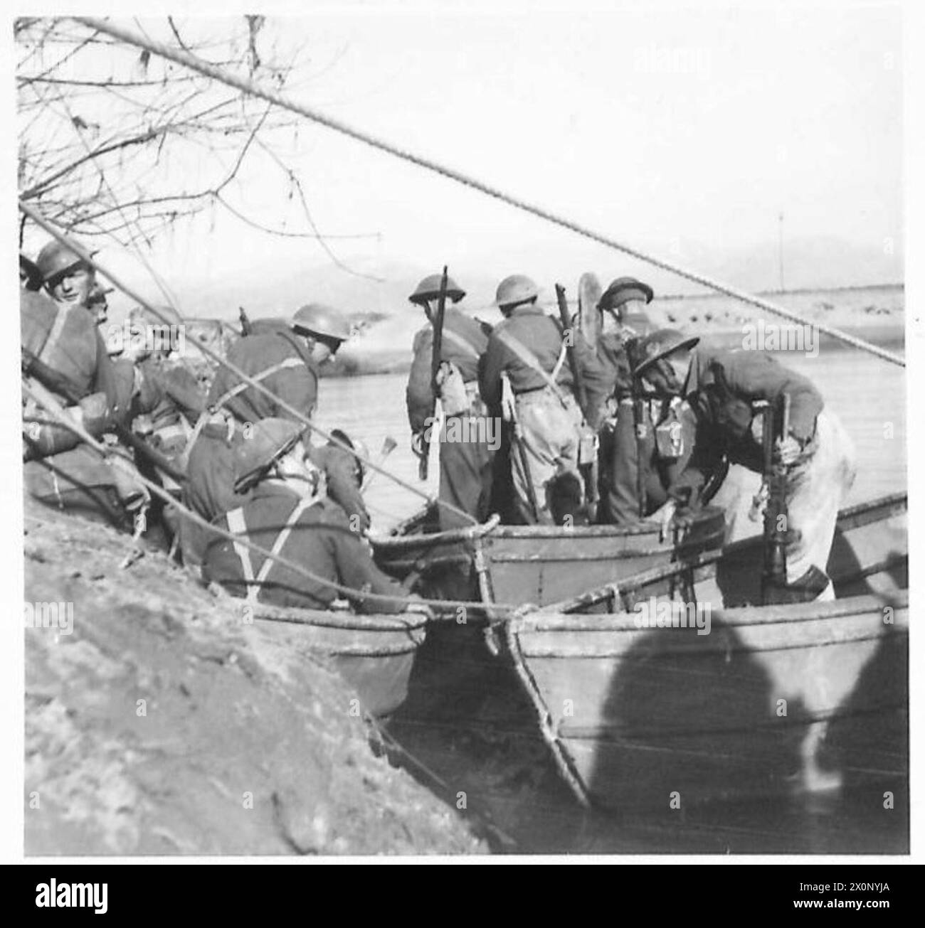Royal Engineers of the Fifth Army cross the Garigliano River to repair ...