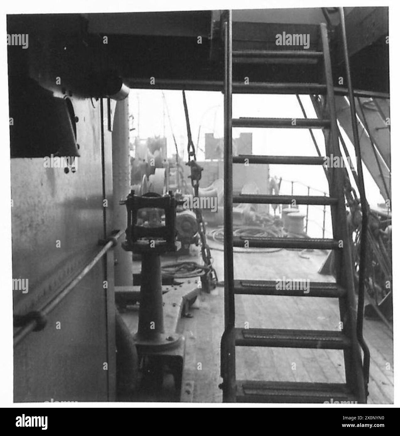A cable-laying ship runs cable from bow sheaves to the number one tank ...
