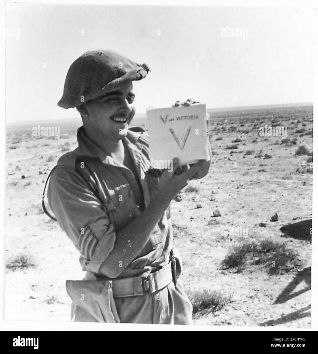 Photograph showing soldiers carrying and deploying the 'V' sign during ...