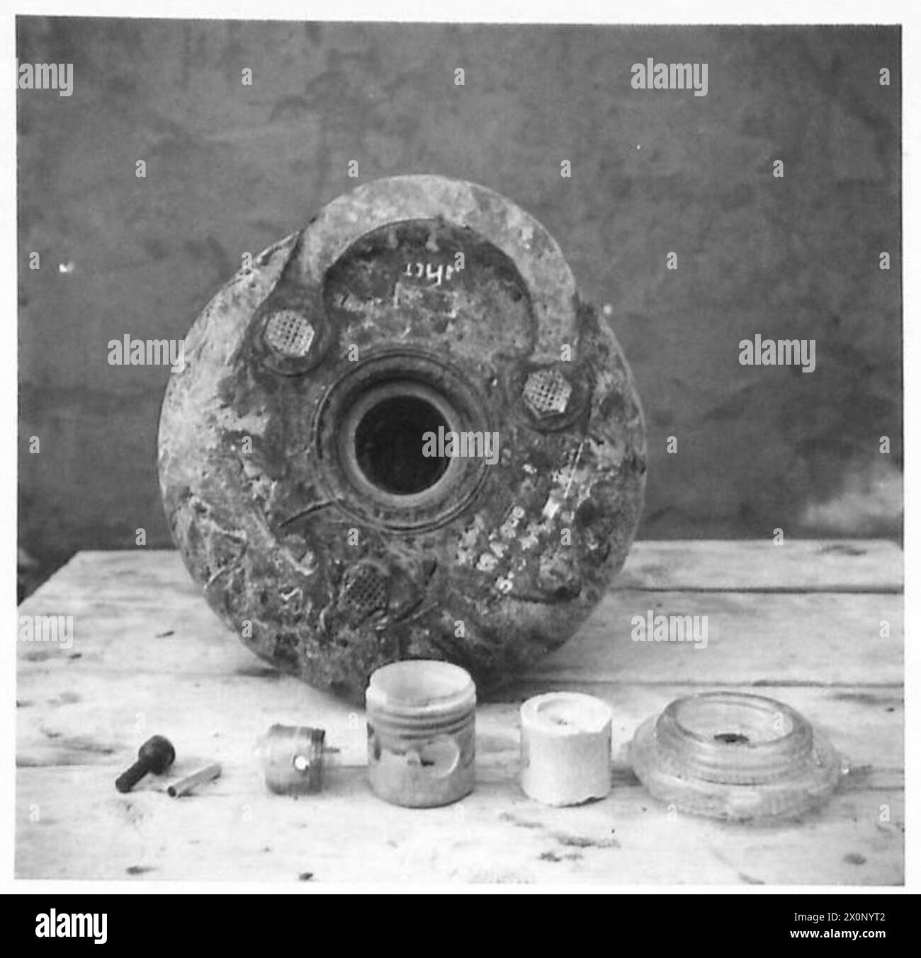 Dismantled enemy mine displayed with components including detonator ...