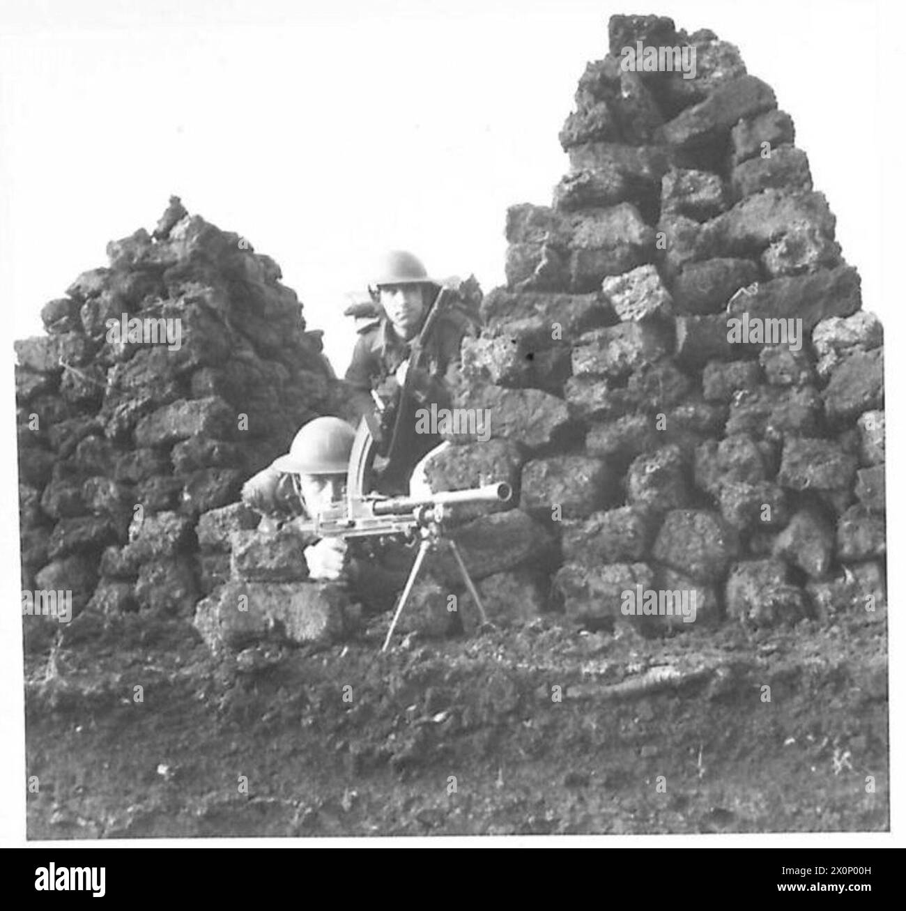 A sniper patrol in Northern Ireland uses the cut face of a bog and ...