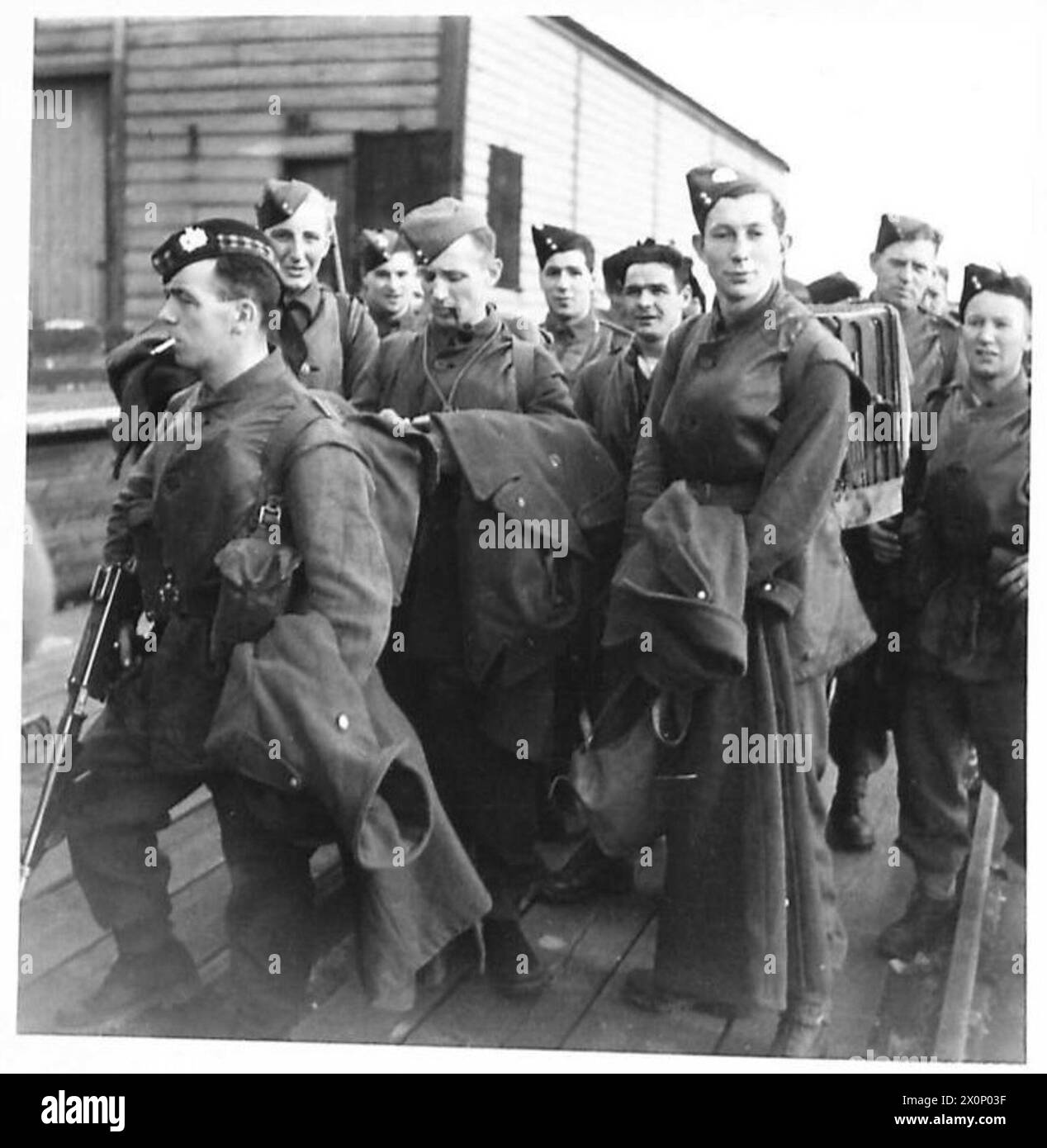 Troops of the British Army line up and prepare to embark during a ...