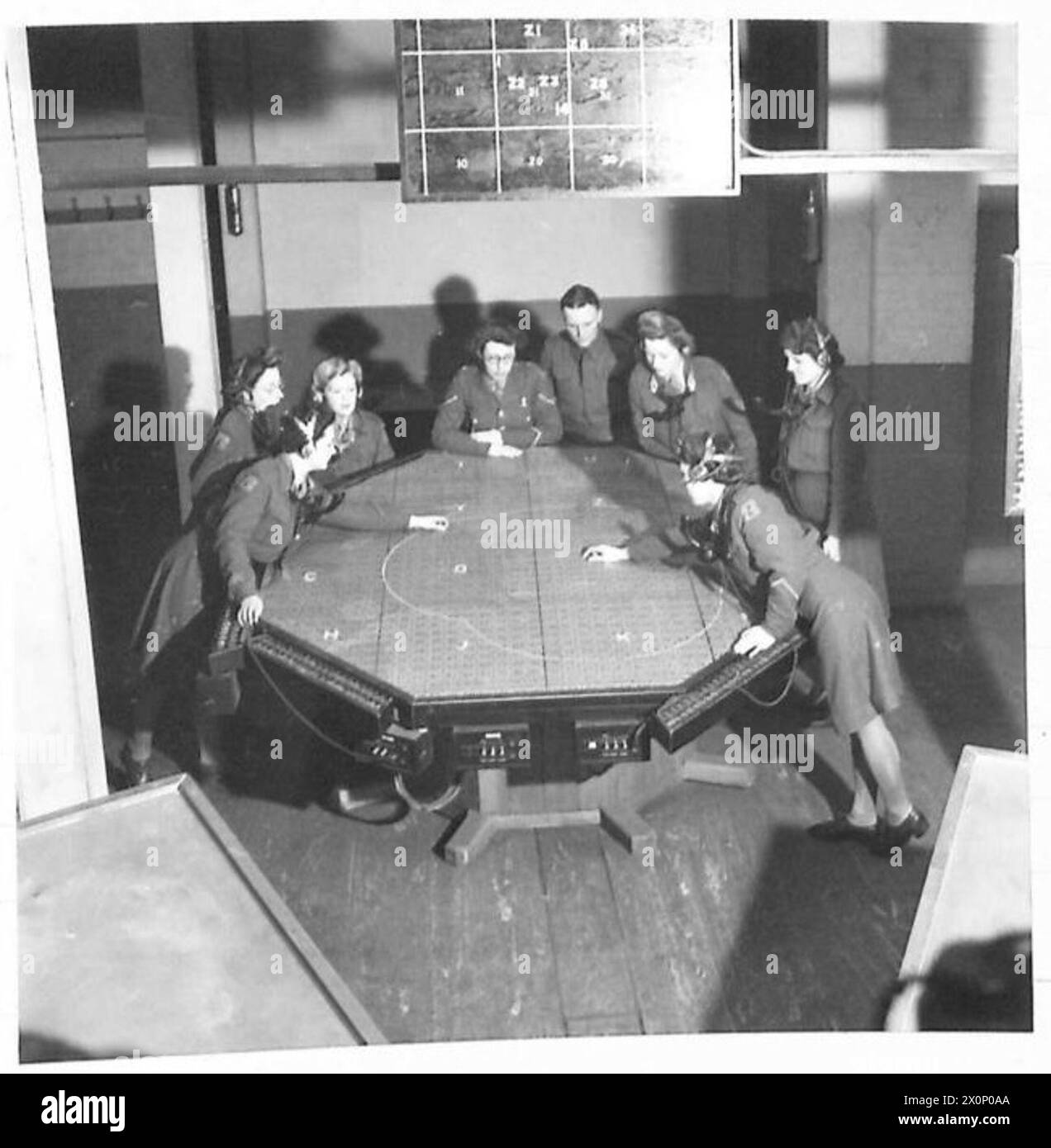 A.T.S. plotters work in Gun Operations Room No. 330 at Palm Court, Park ...