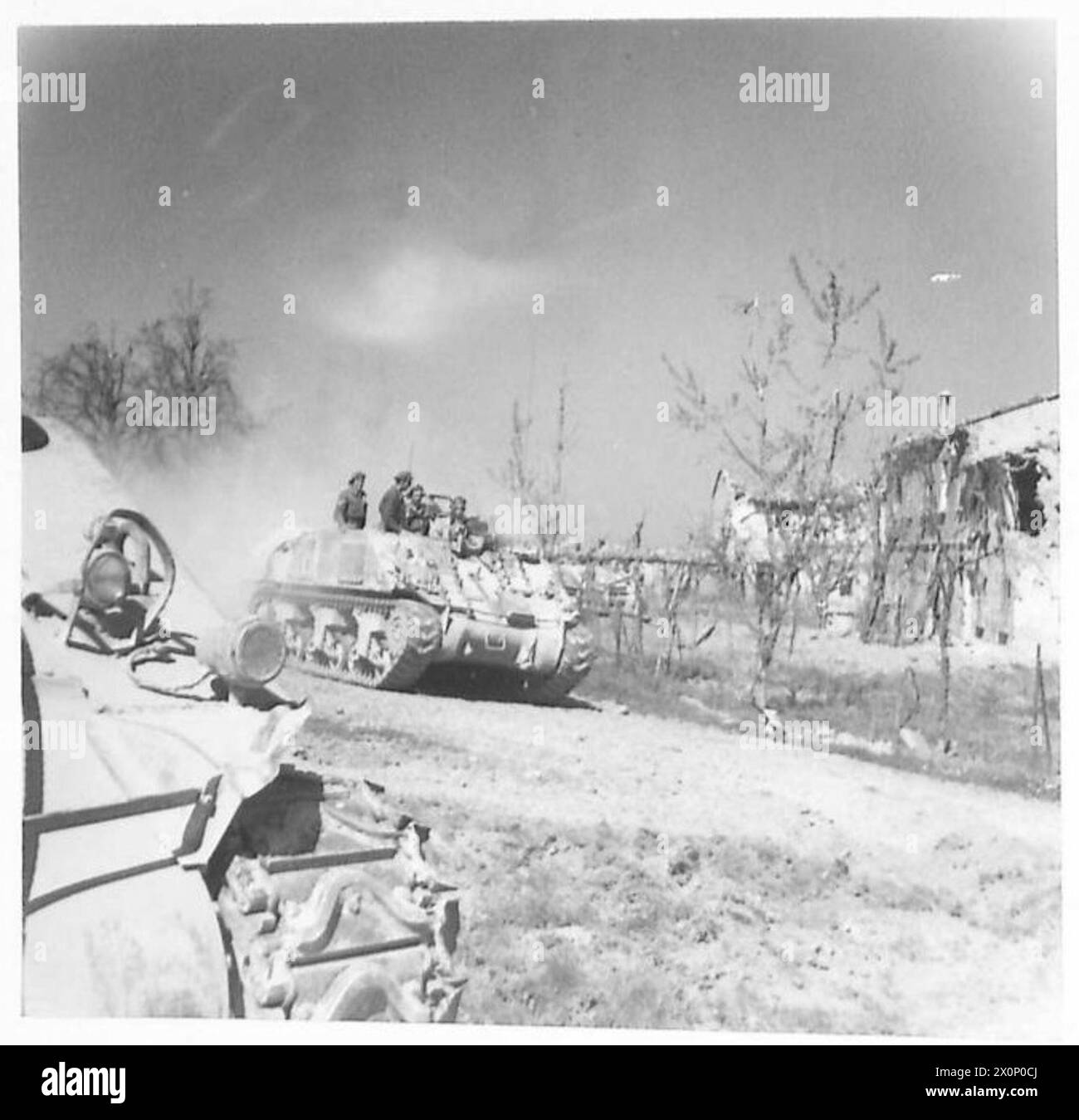Tanks from the 4th Hussars of the Eighth Army advance into Cotignola ...