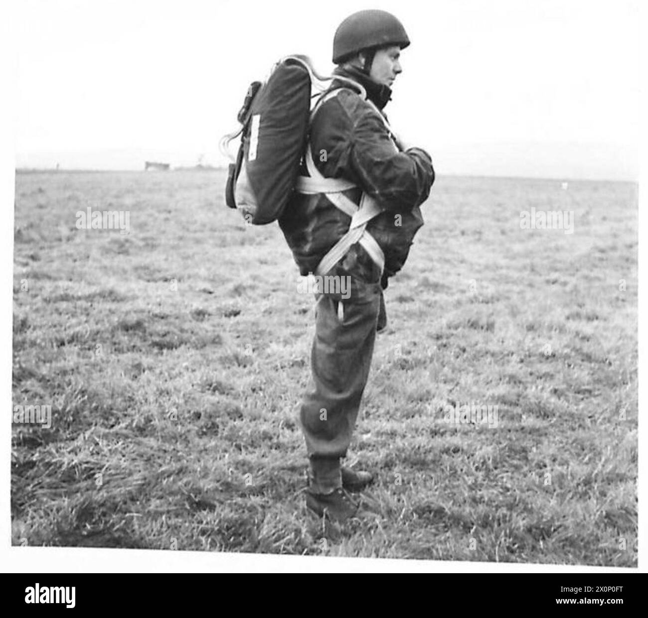 Photograph shows parachutists equipped for jumping with jumping jackets ...