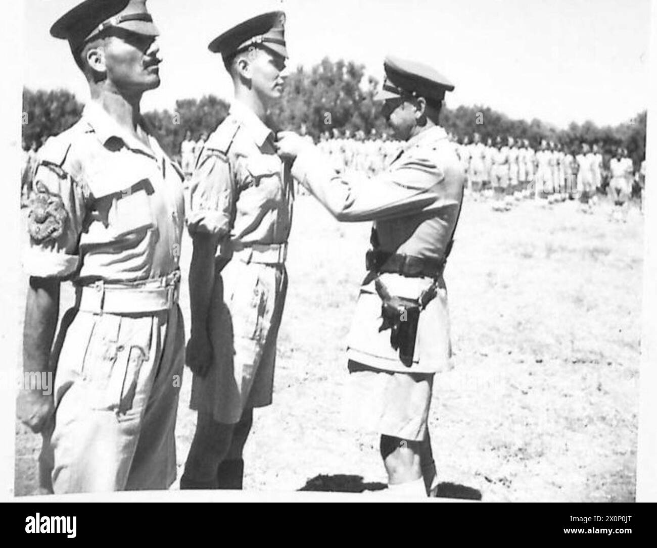 General Alexander awards the Victoria Cross ribbon to Sergeant ...