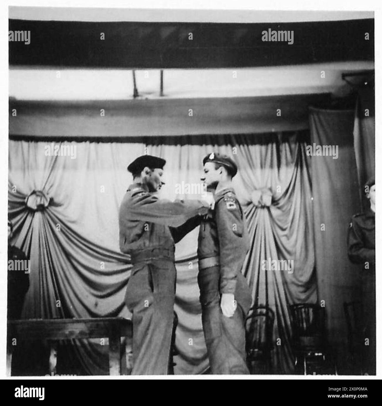 Captain J.M. Willcox of RAMC attached to 8th Rifle Brigade received the ...