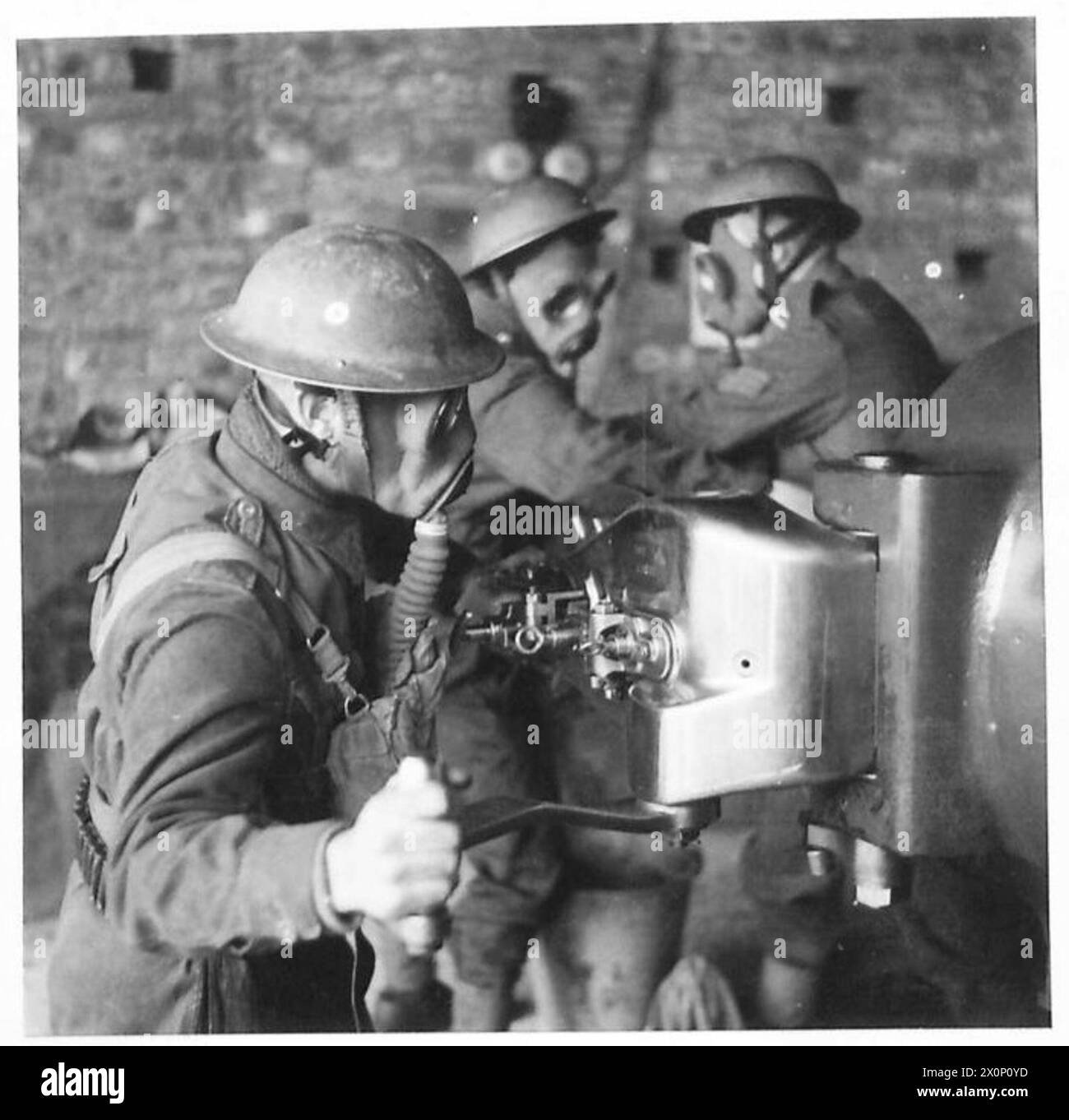 GUNNERY PRACTICE IN SCOTLAND - The gunners do their drill in gas masks ...