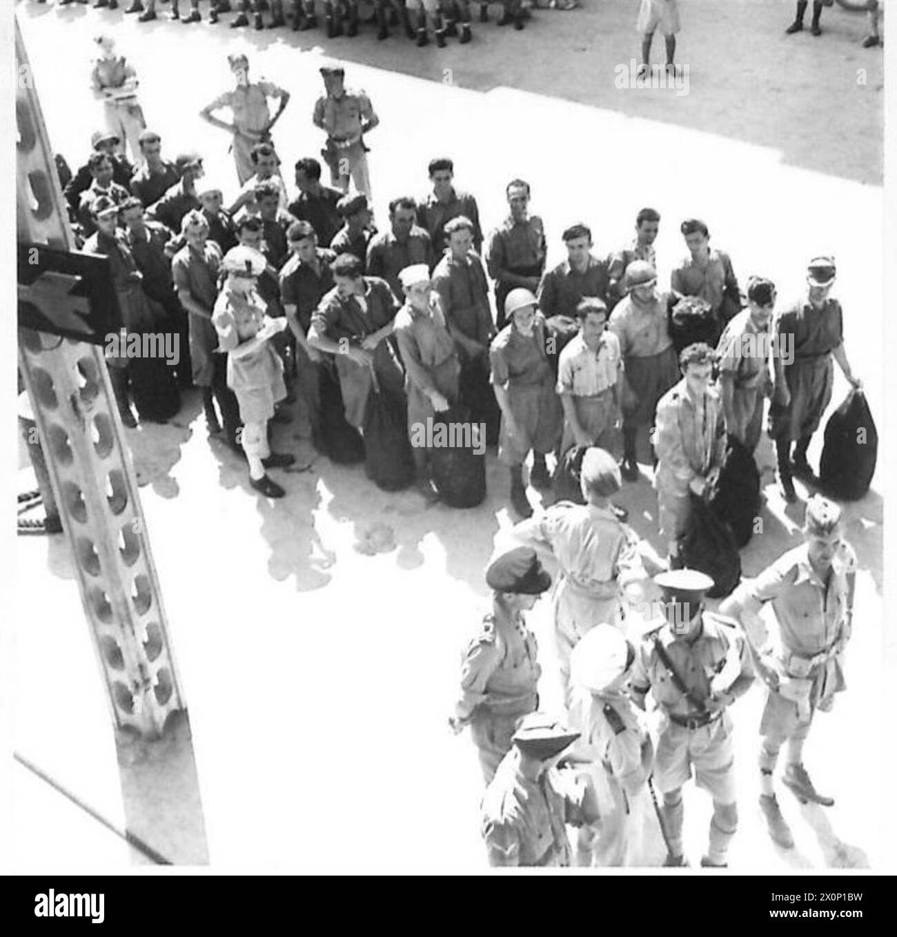 Sicilian prisoners line up on the bridge of a landing craft in Malta ...